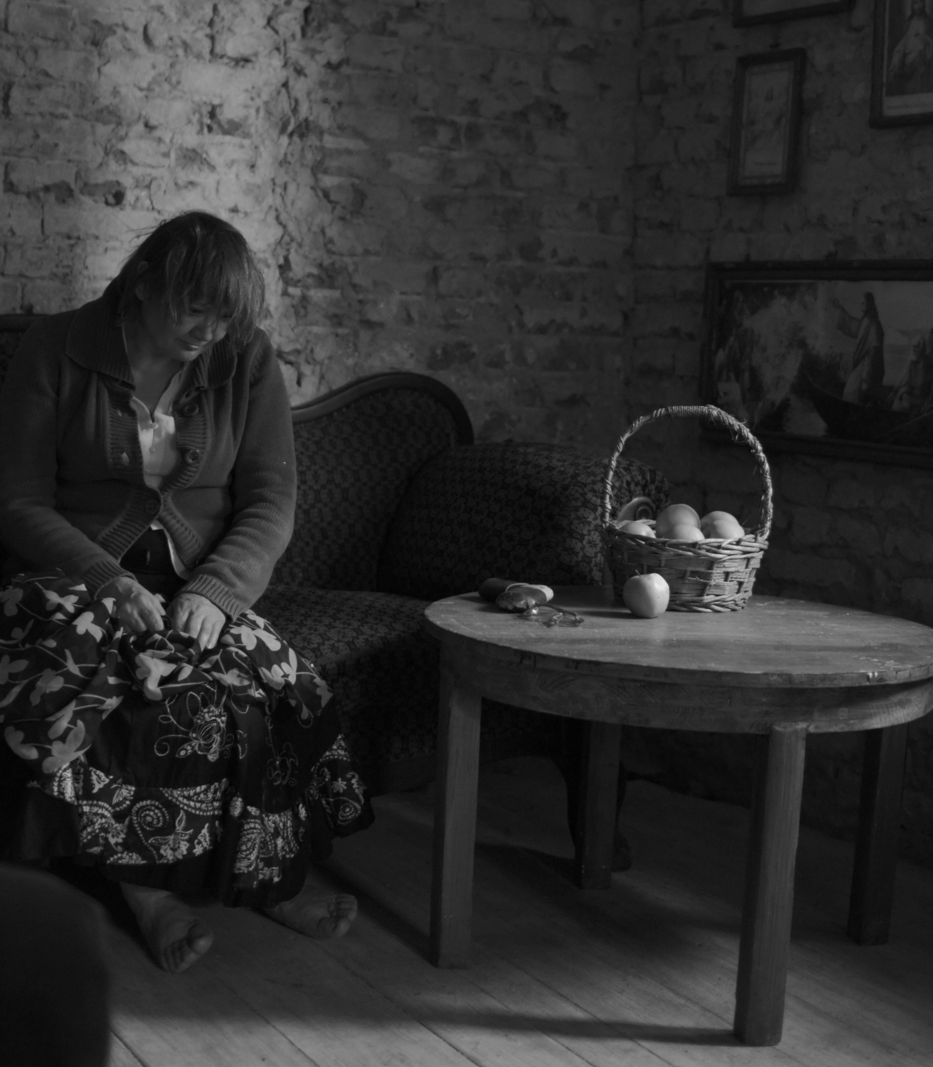 A Sad Woman Sitting on a Sofa Alone · Free Stock Photo