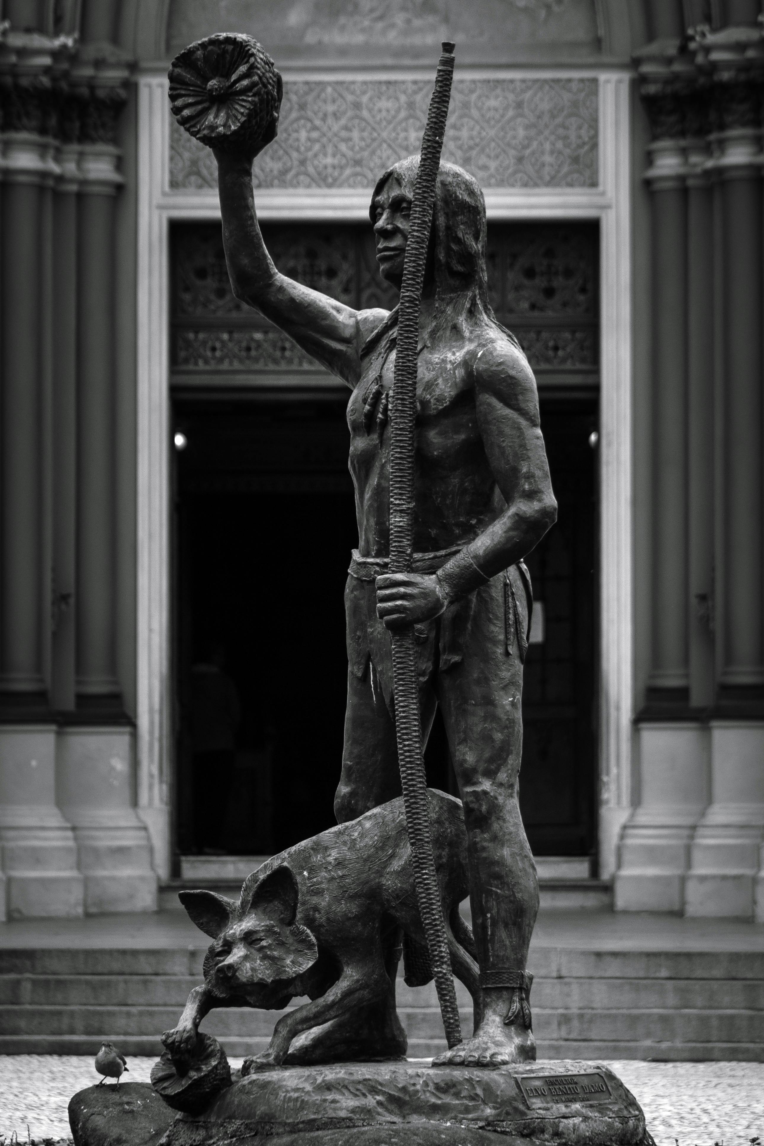 Statue of Hunter with Arch and Dog · Free Stock Photo