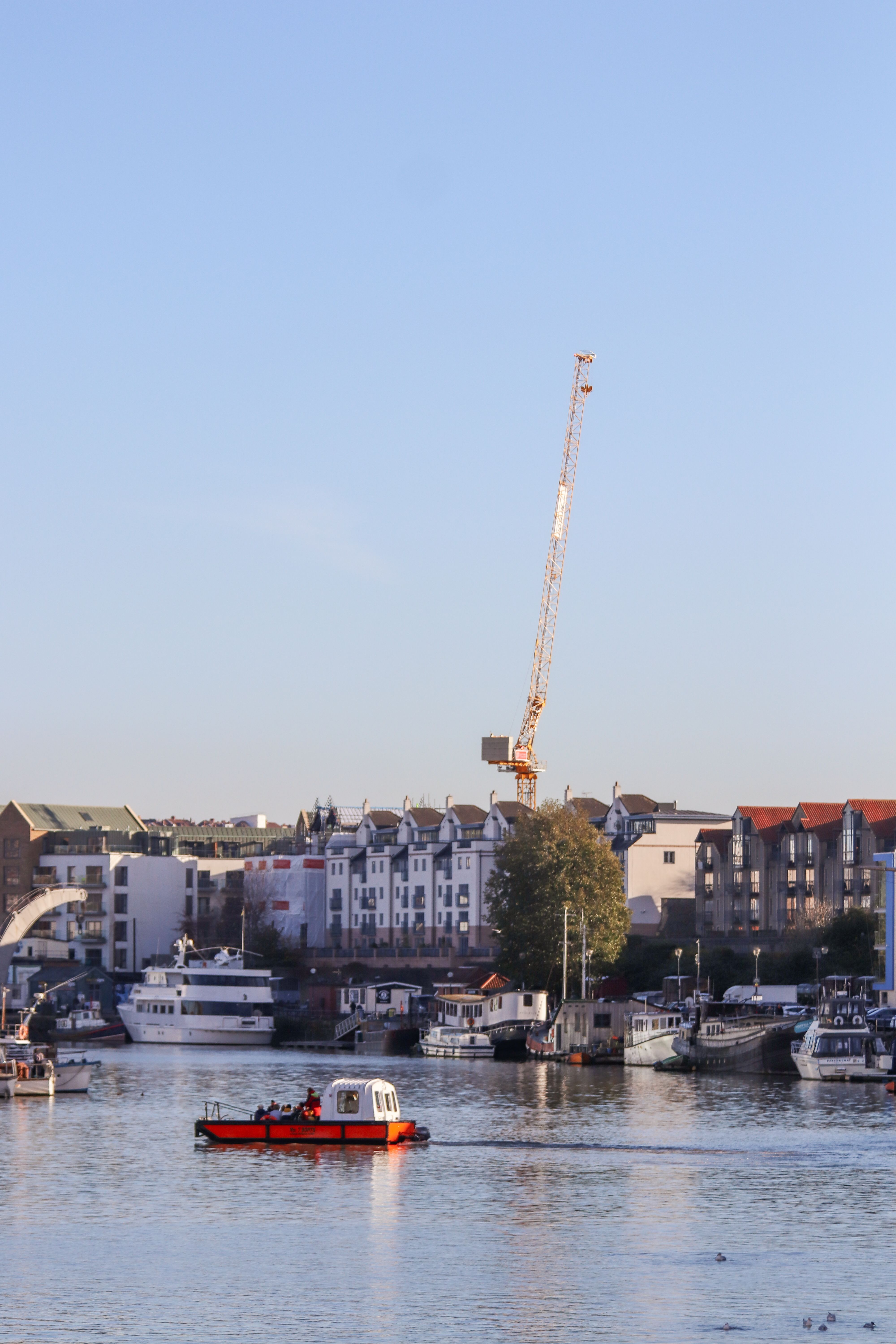 View of Boats on a Body of Water and Buildings in City · Free Stock Photo