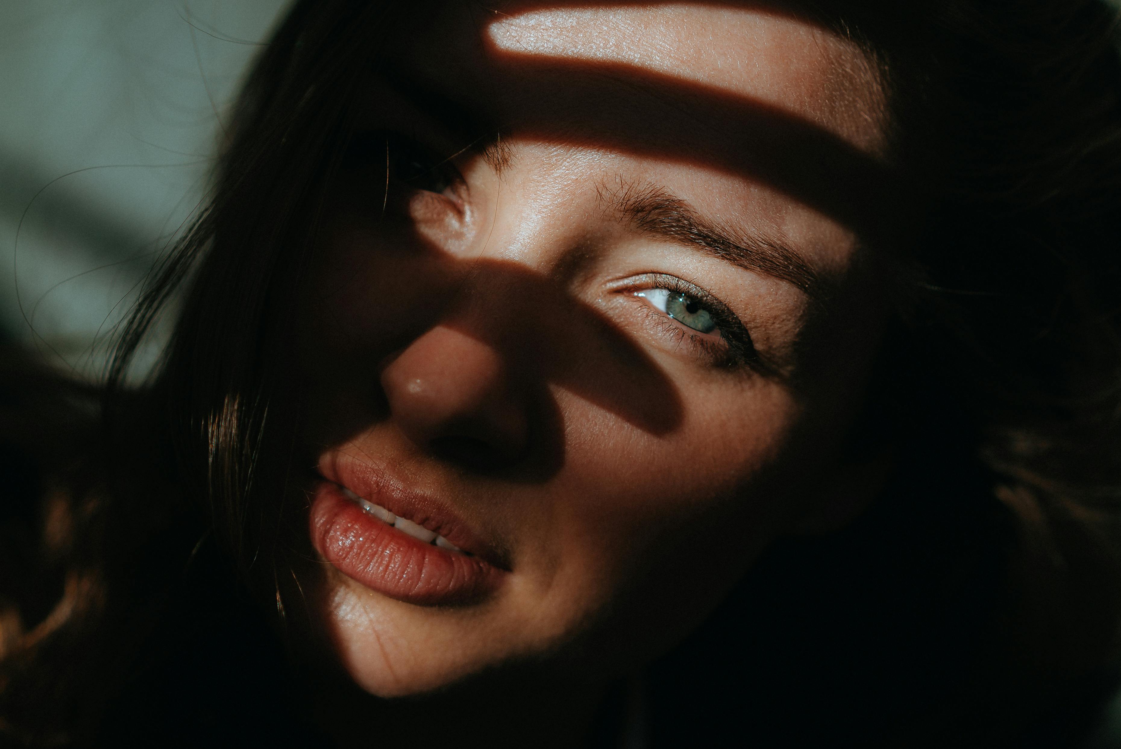 Woman Holding a Lit Lighter in Front of Her Face · Free Stock Photo