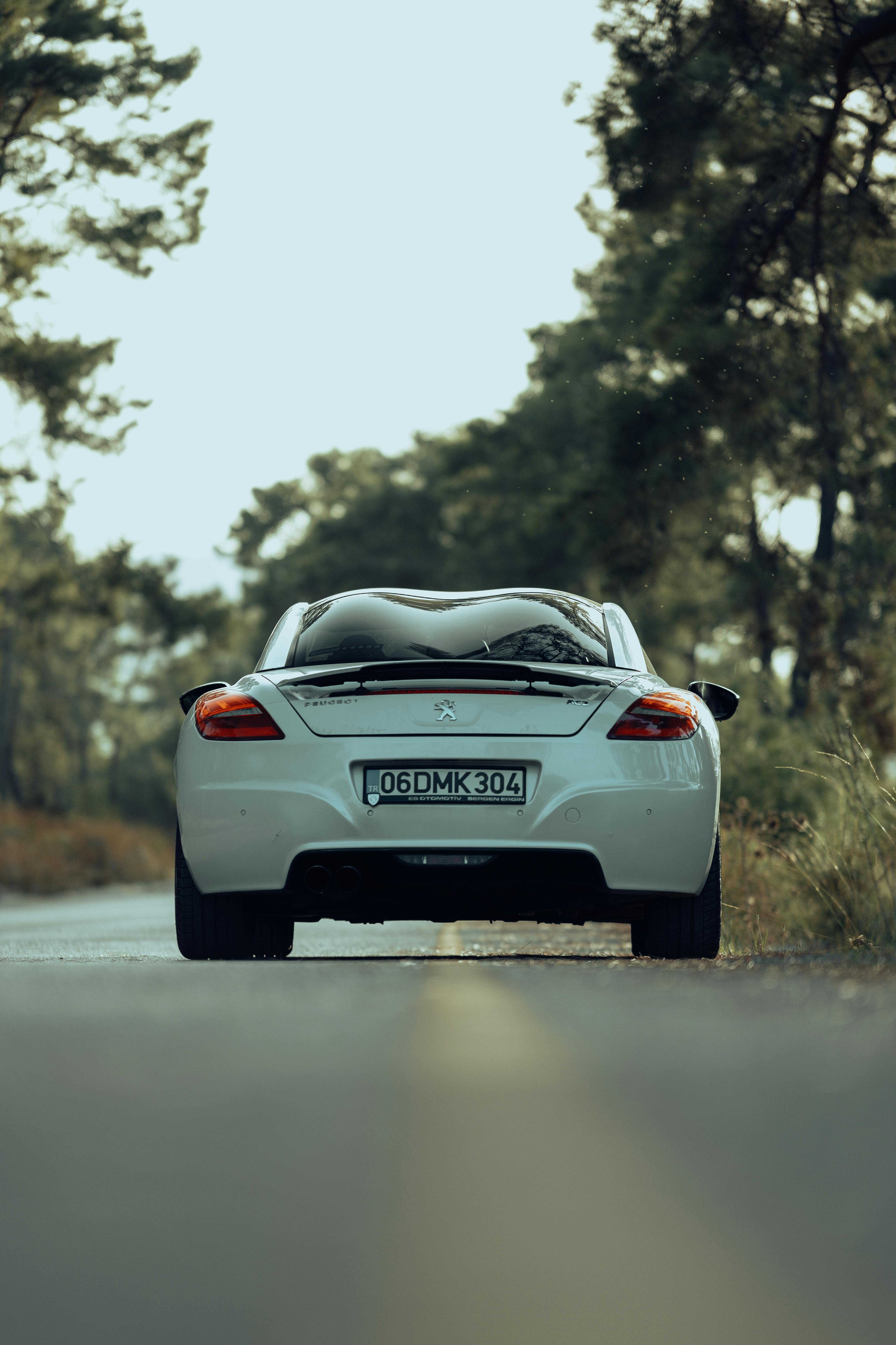 Back View of White Peugeot RCZ on Road · Free Stock Photo