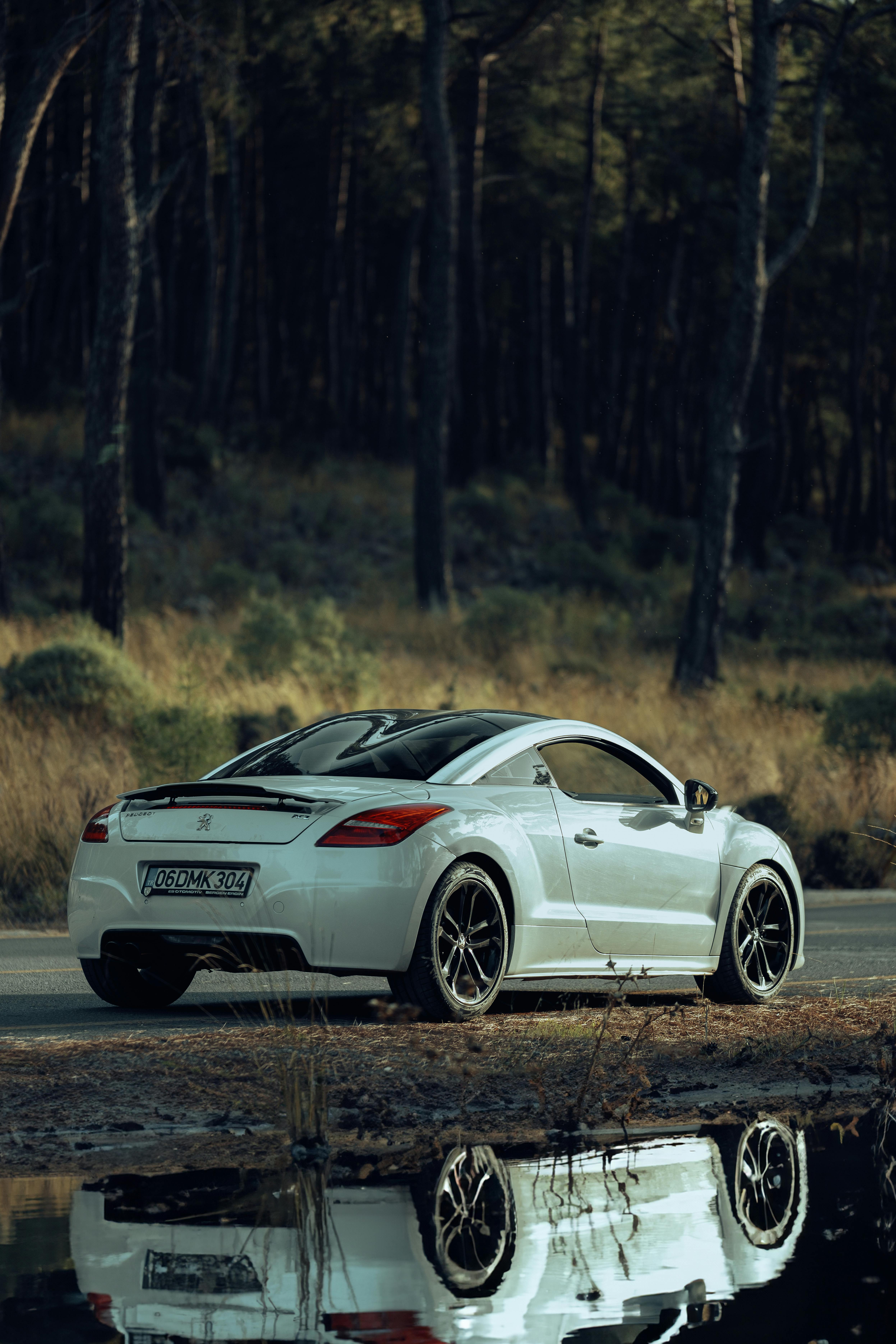 White Peugeot RCZ near Water · Free Stock Photo