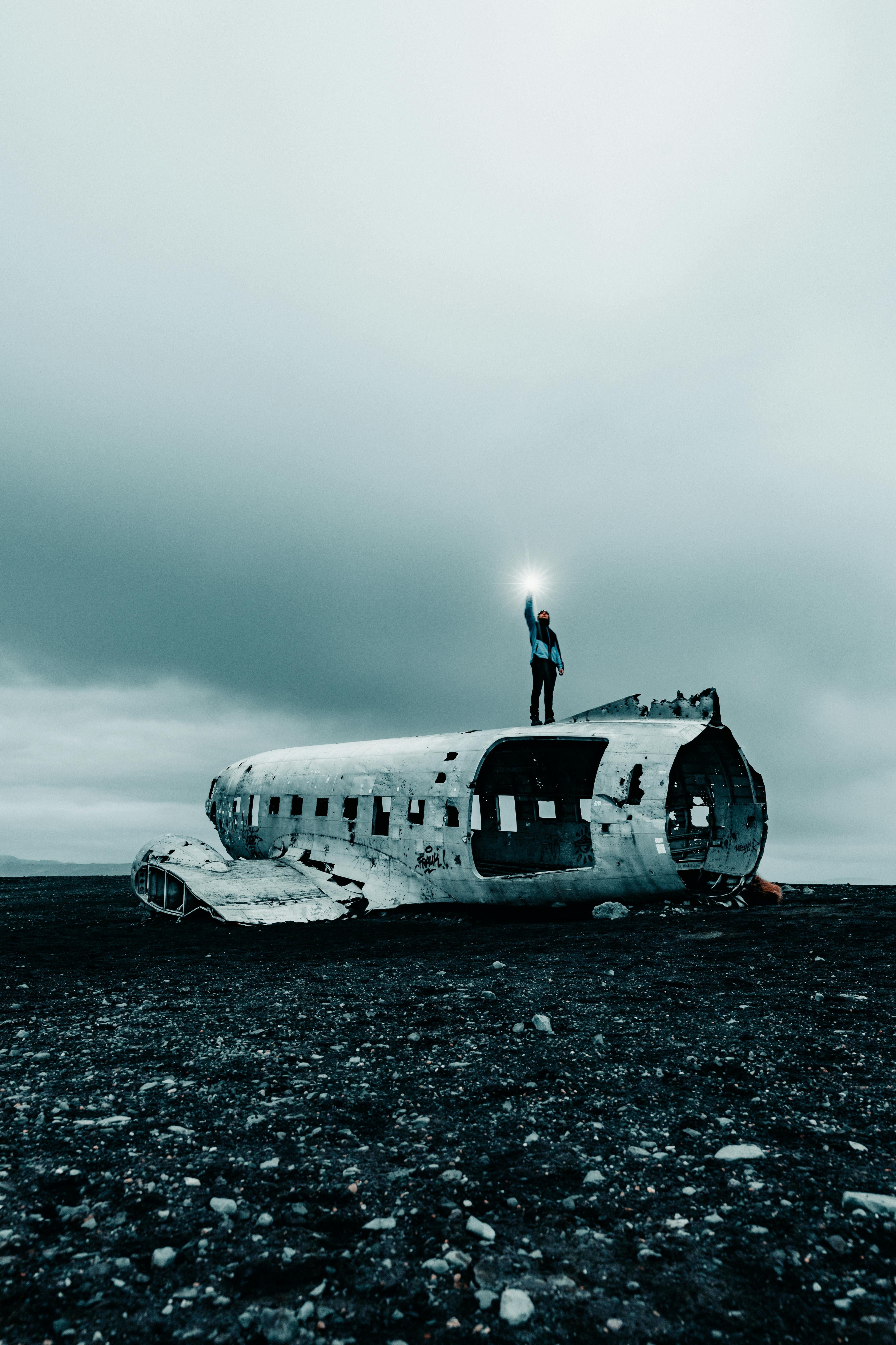 Man Standing on Broken Airplane · Free Stock Photo