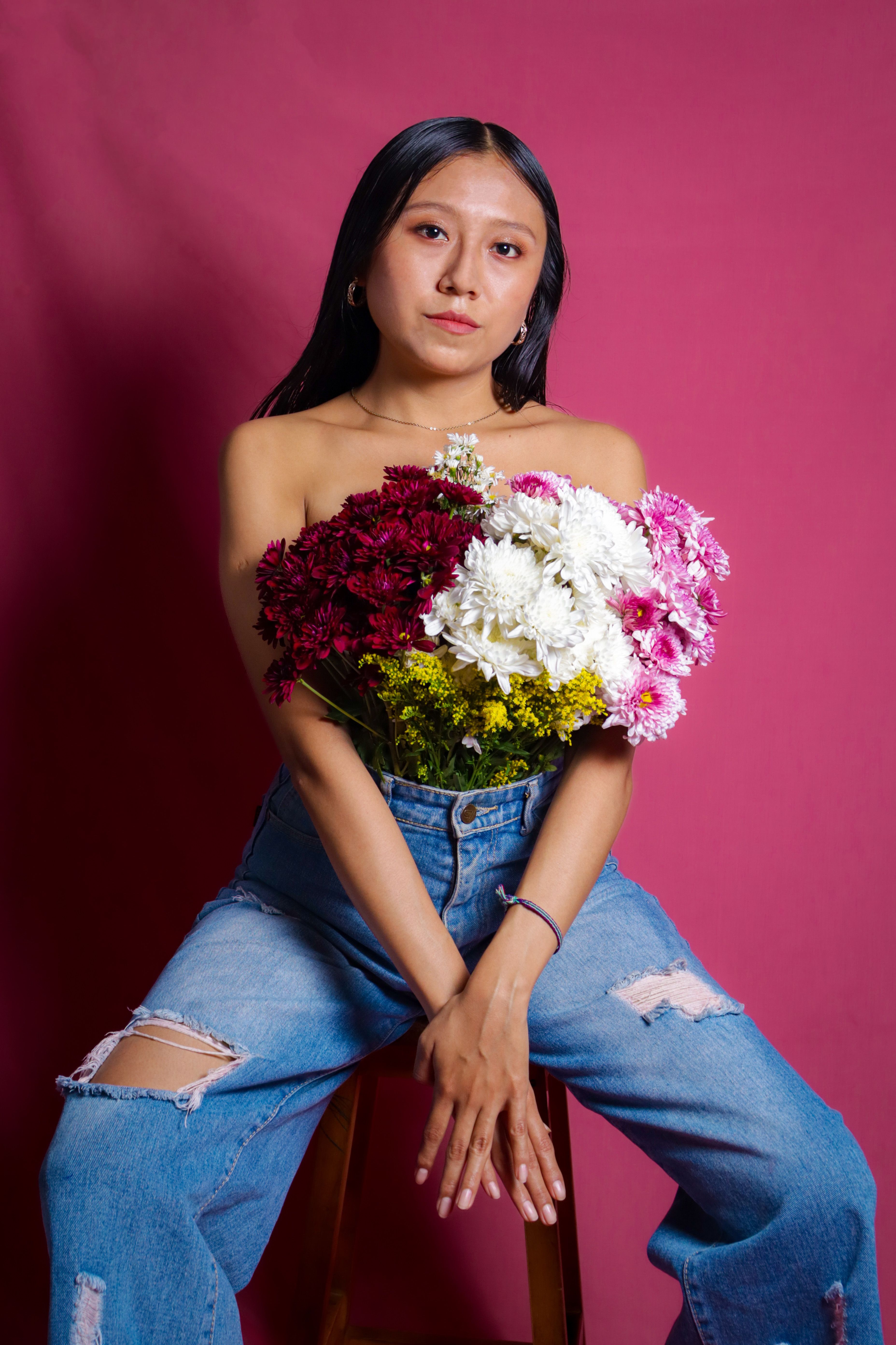 Shirtless Woman Covering Chest with Flower Bouquet · Free Stock Photo
