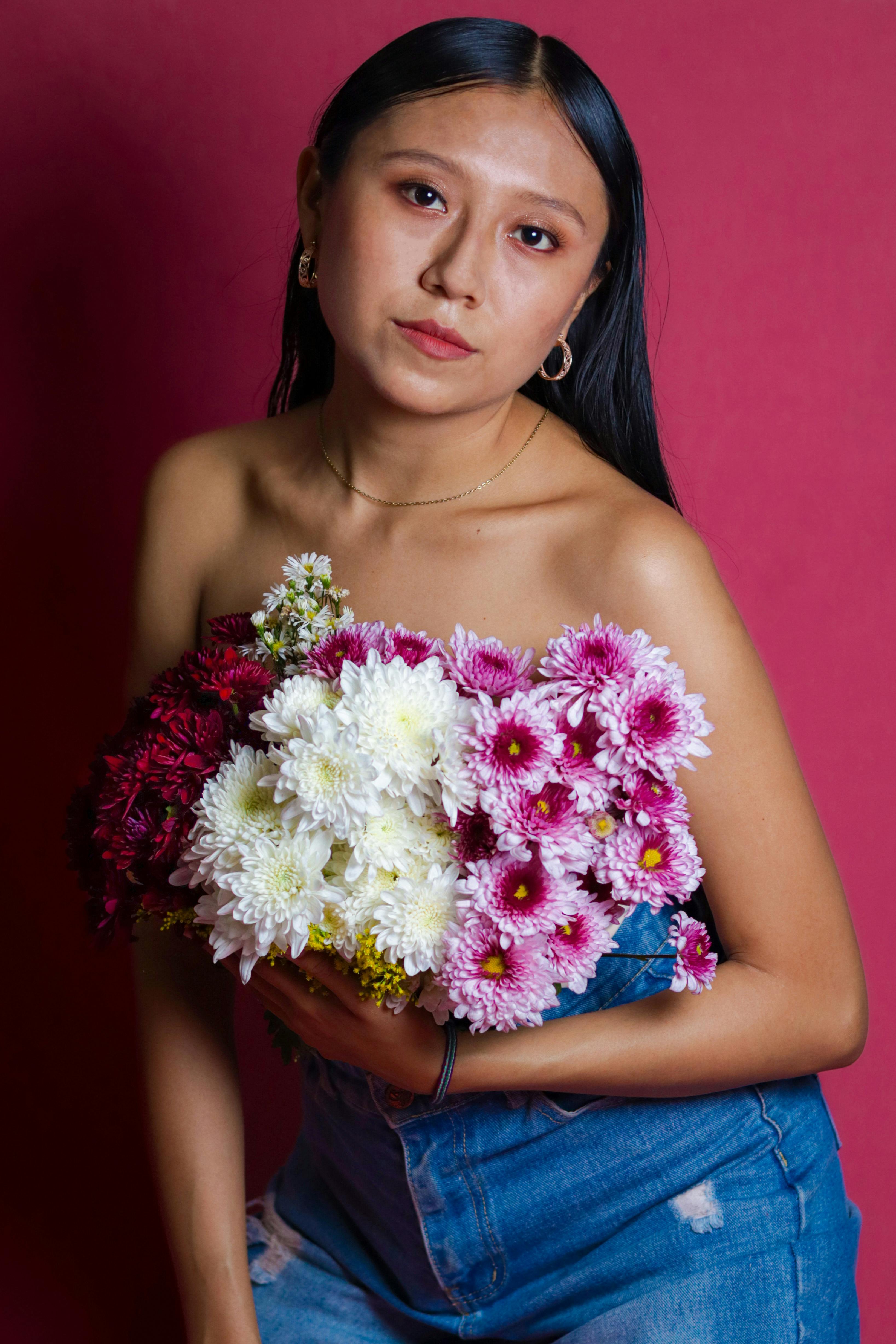 Shirtless Woman Covering Chest with Flower Bouquet · Free Stock Photo
