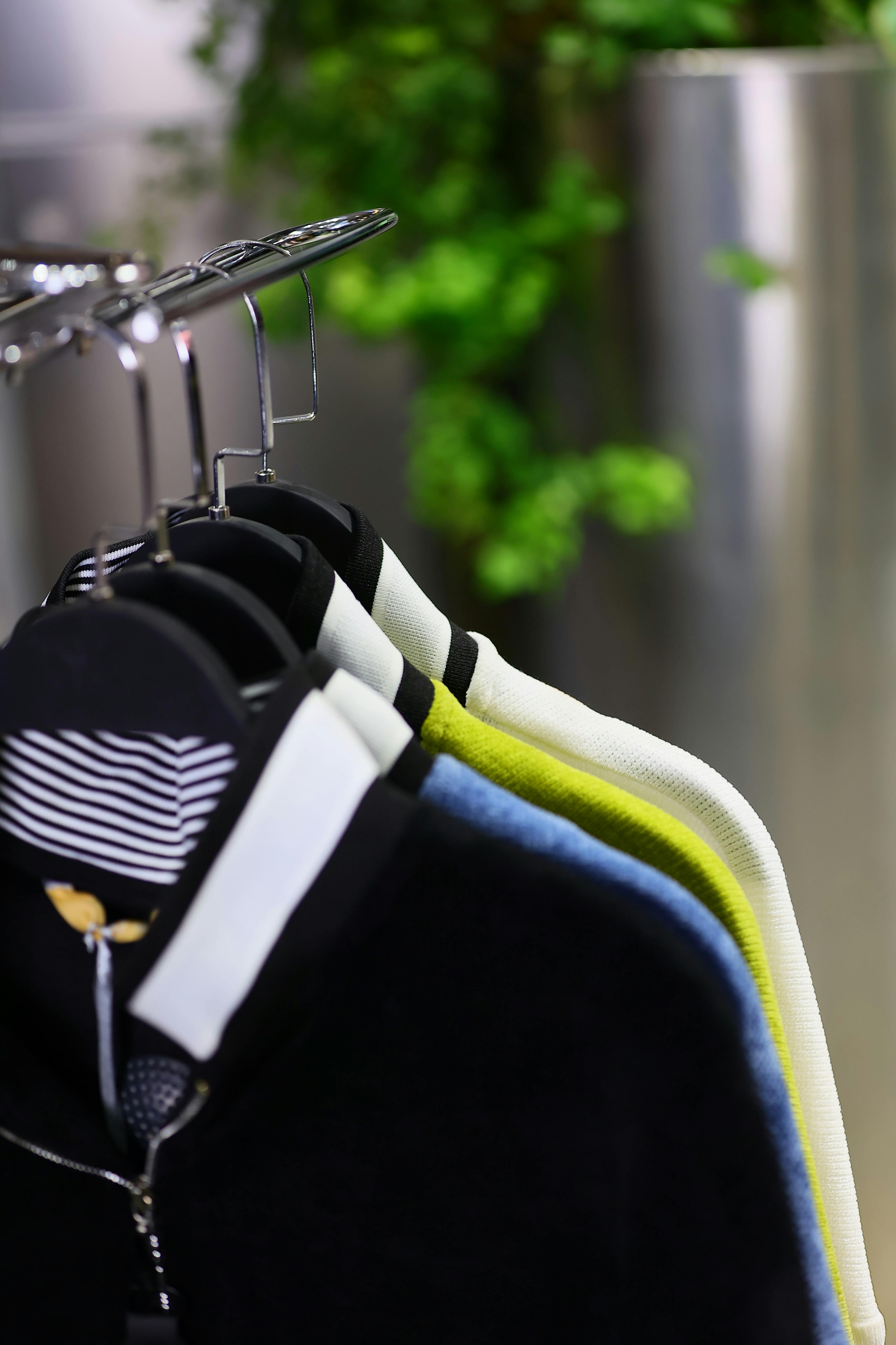 White T-shirt on Clothes Rack · Free Stock Photo