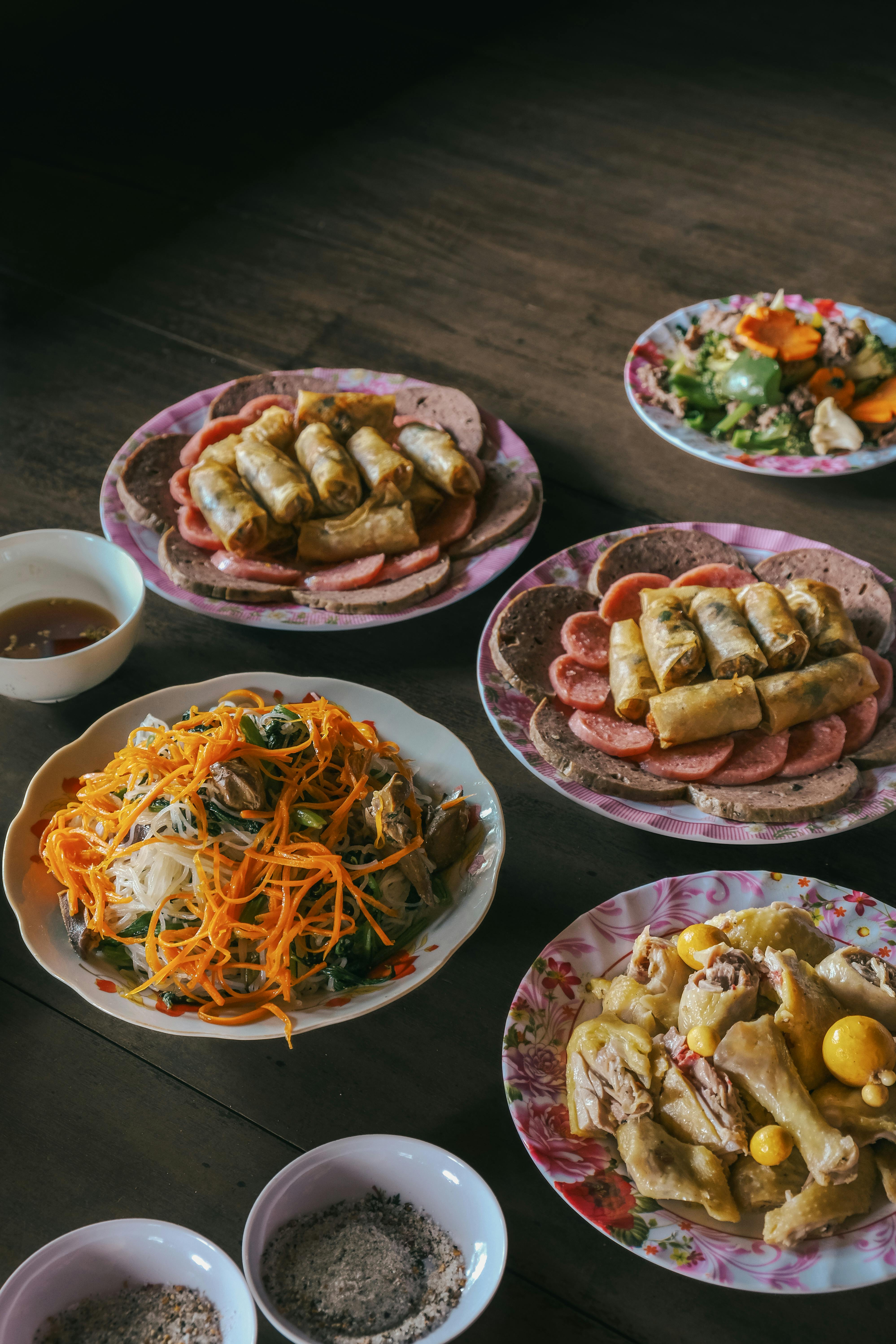 Delicious Vietnamese Meals on Plates on Table · Free Stock Photo