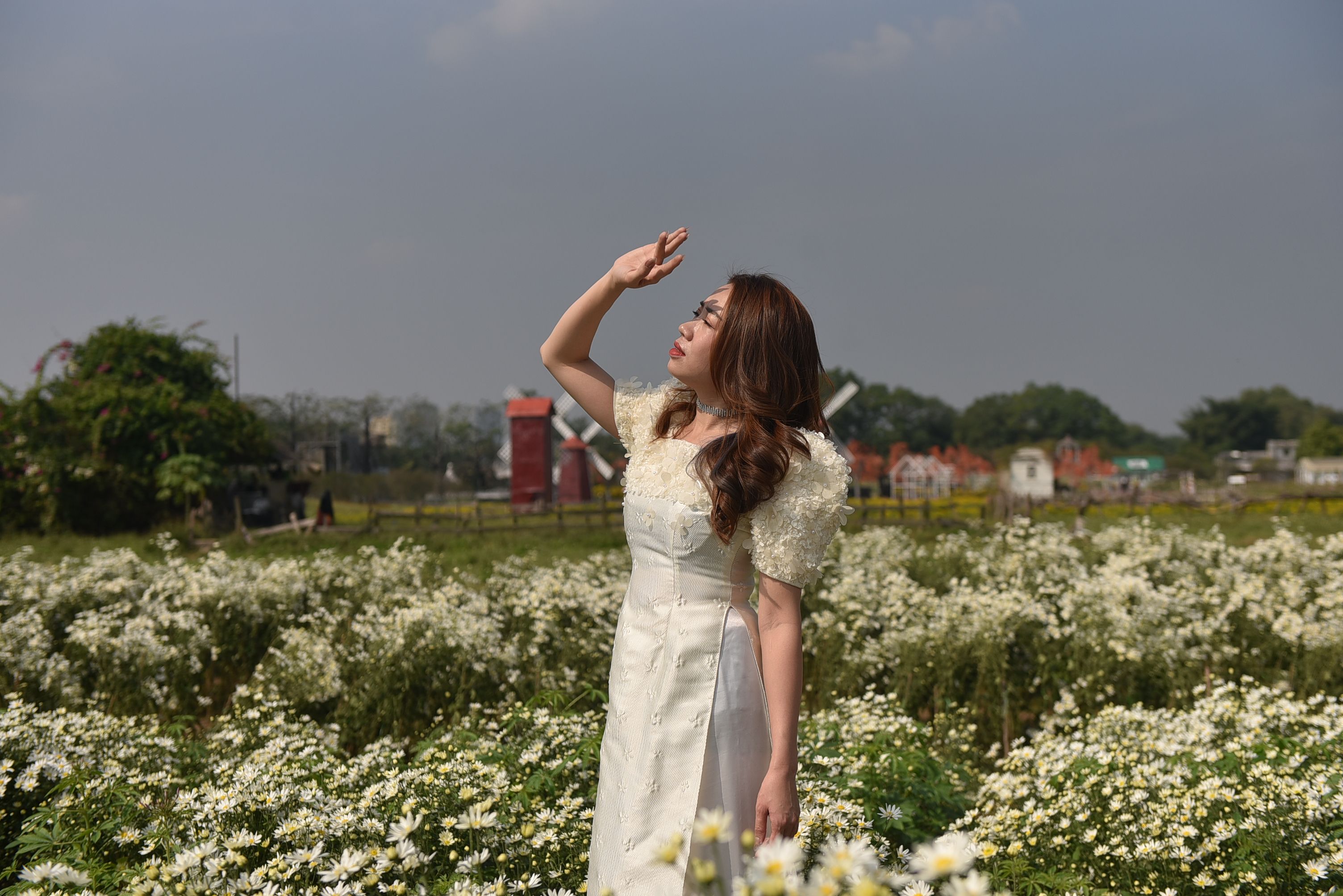 Woman Shielding her Face from the Sun · Free Stock Photo