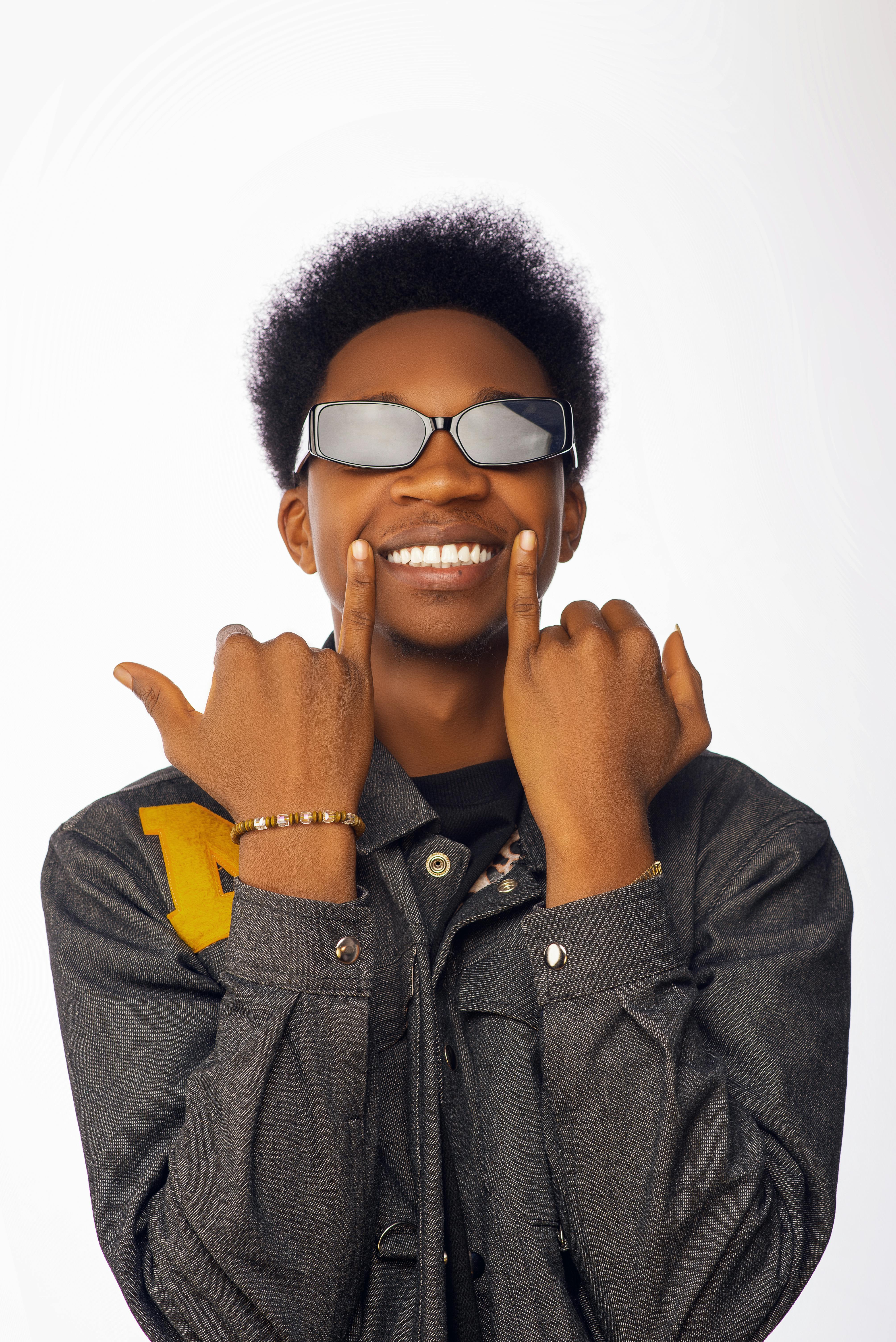 Smiling Models Posing in Sunglasses · Free Stock Photo