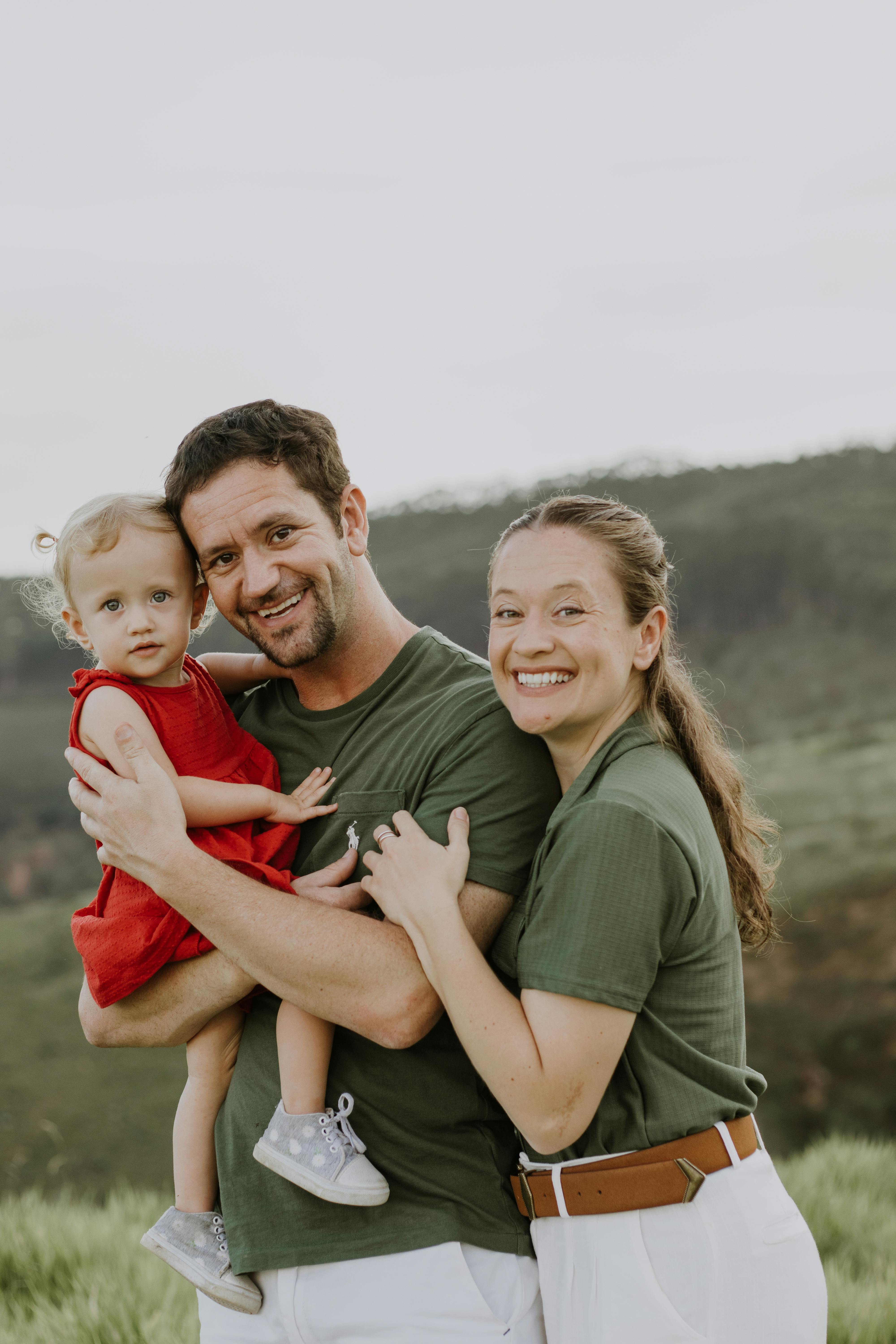 Portrait of Parents with Their Daughter · Free Stock Photo