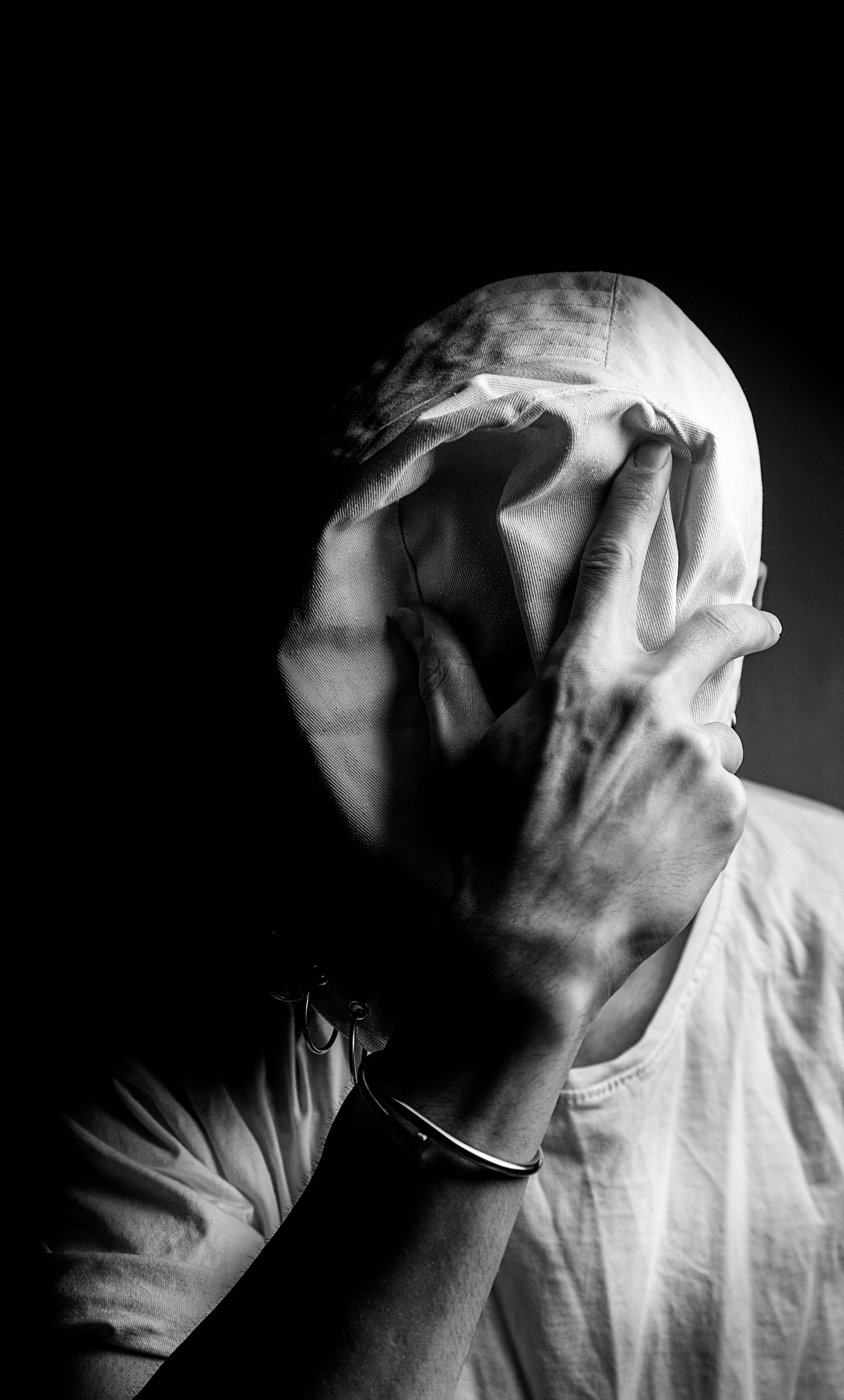 A Person Covering their Face · Free Stock Photo