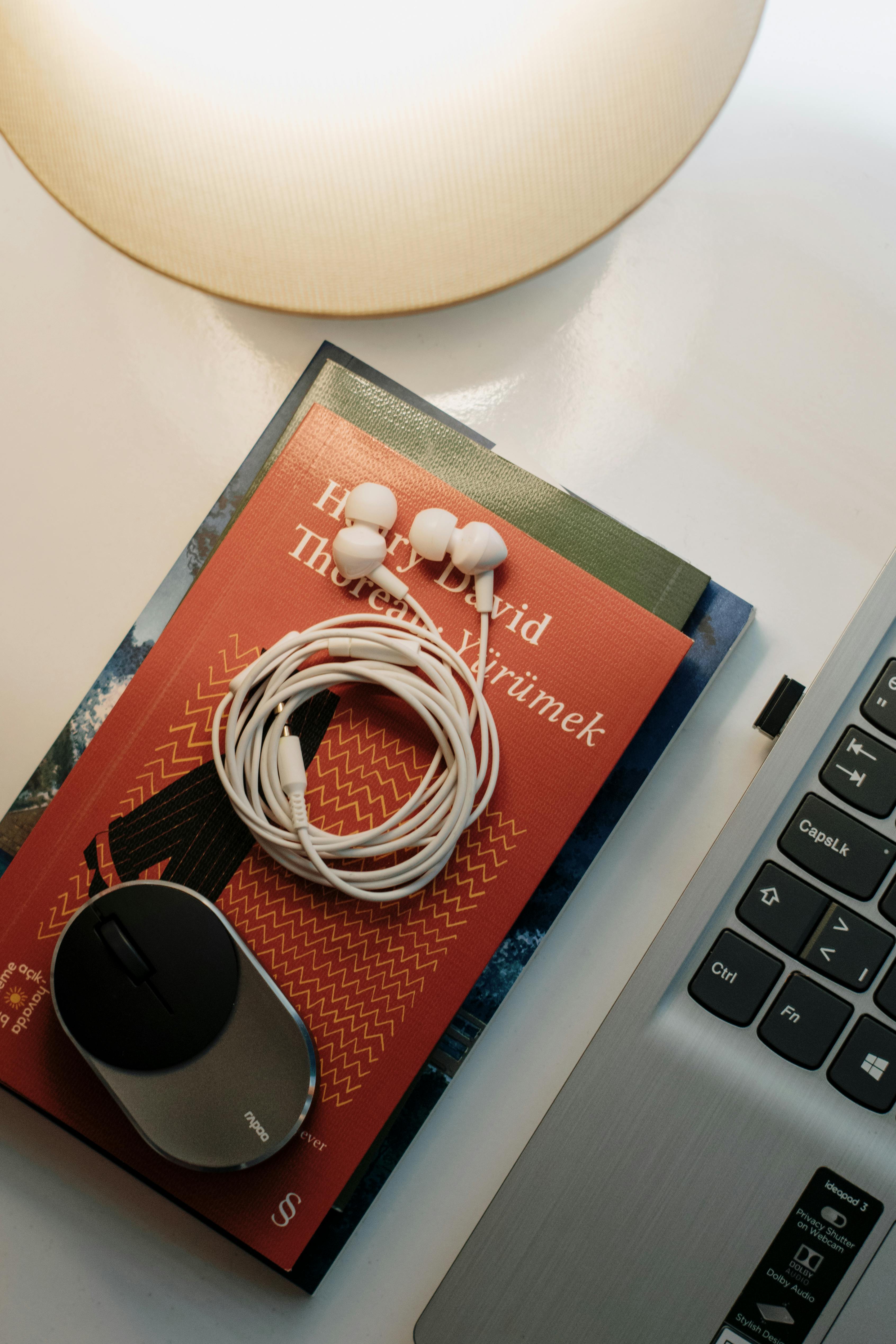 Book and Earphones on a Cabinet · Free Stock Photo