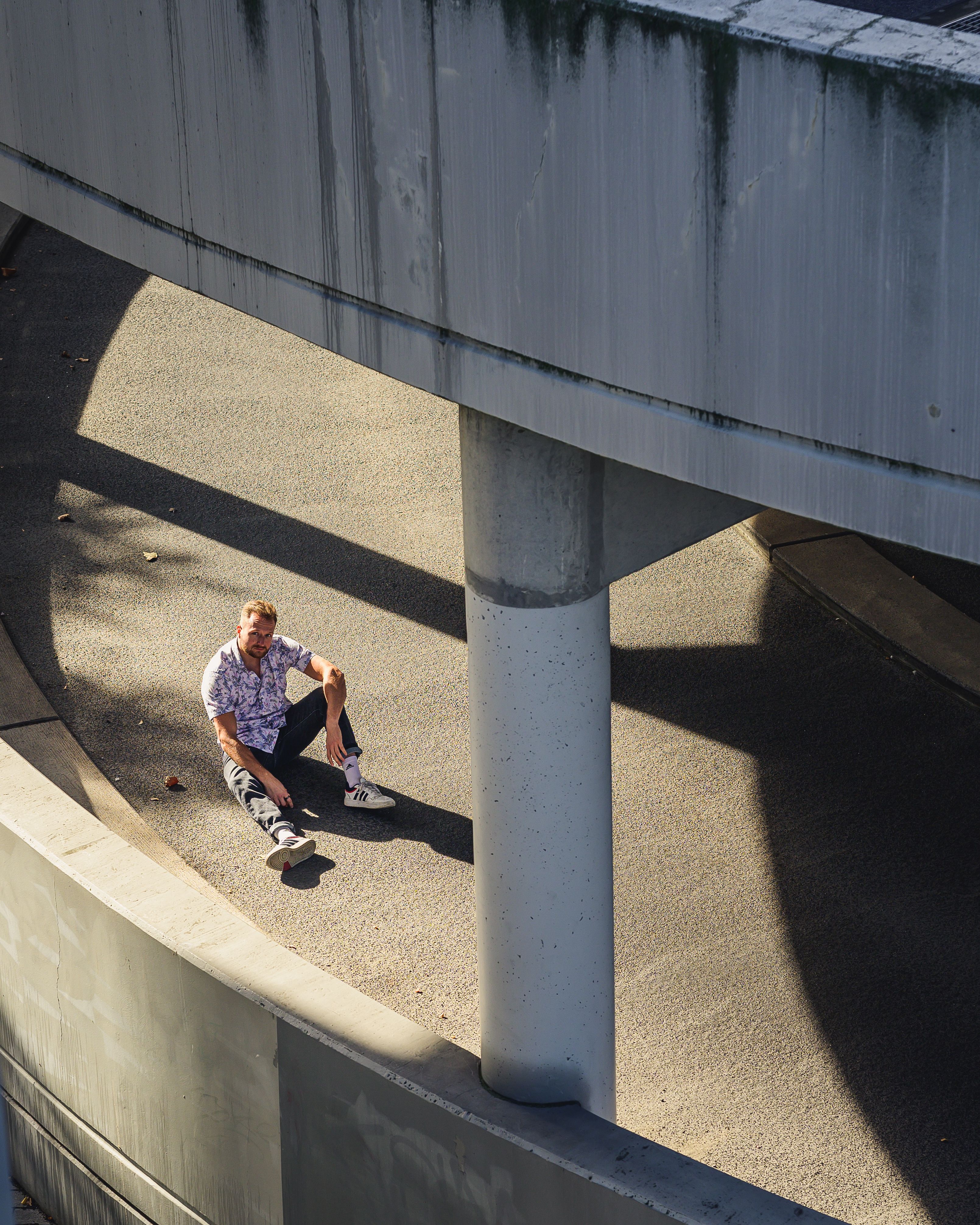 Man Sitting in Sunlight · Free Stock Photo