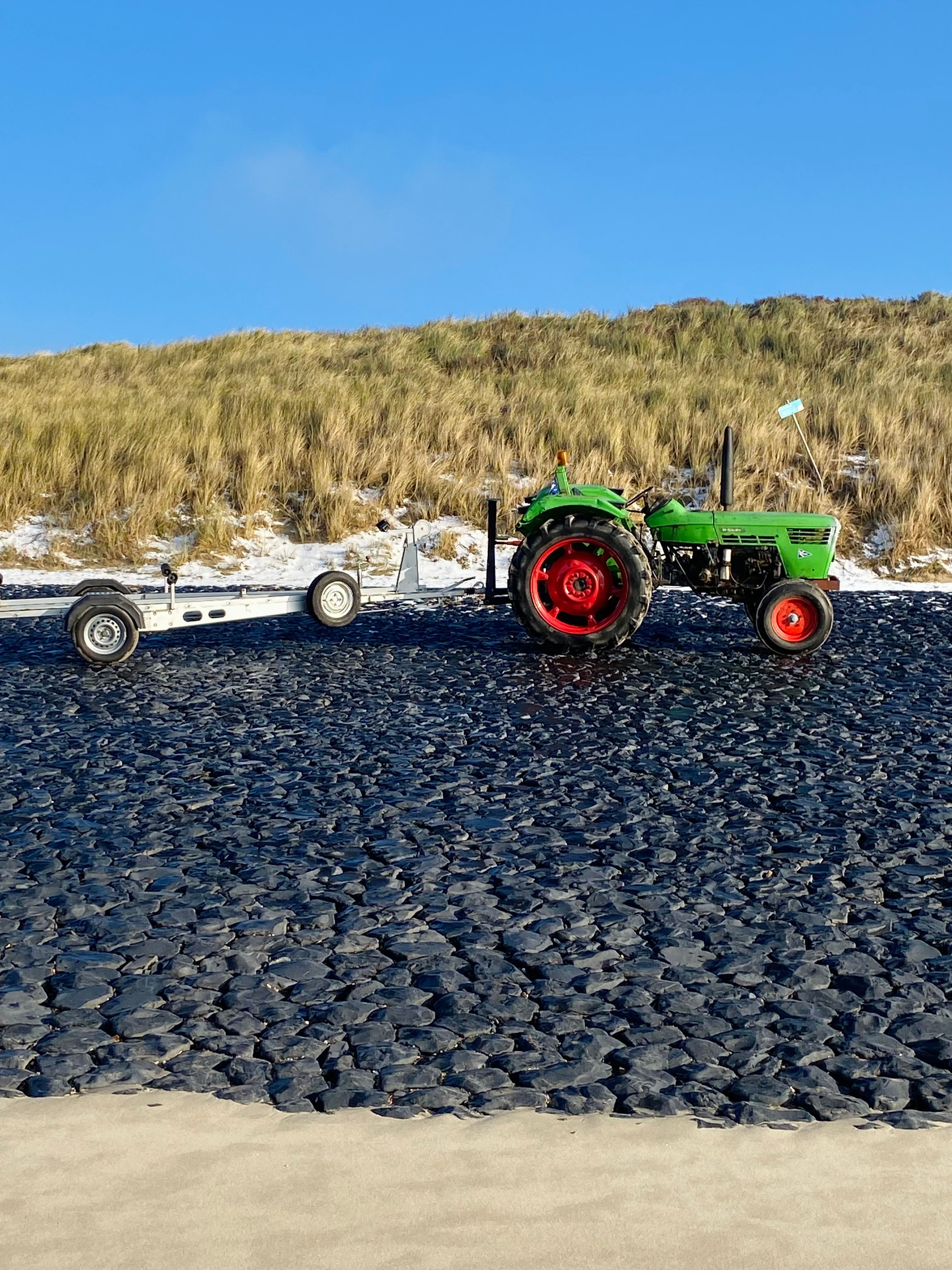 Tractor at Rocky Beach · Free Stock Photo