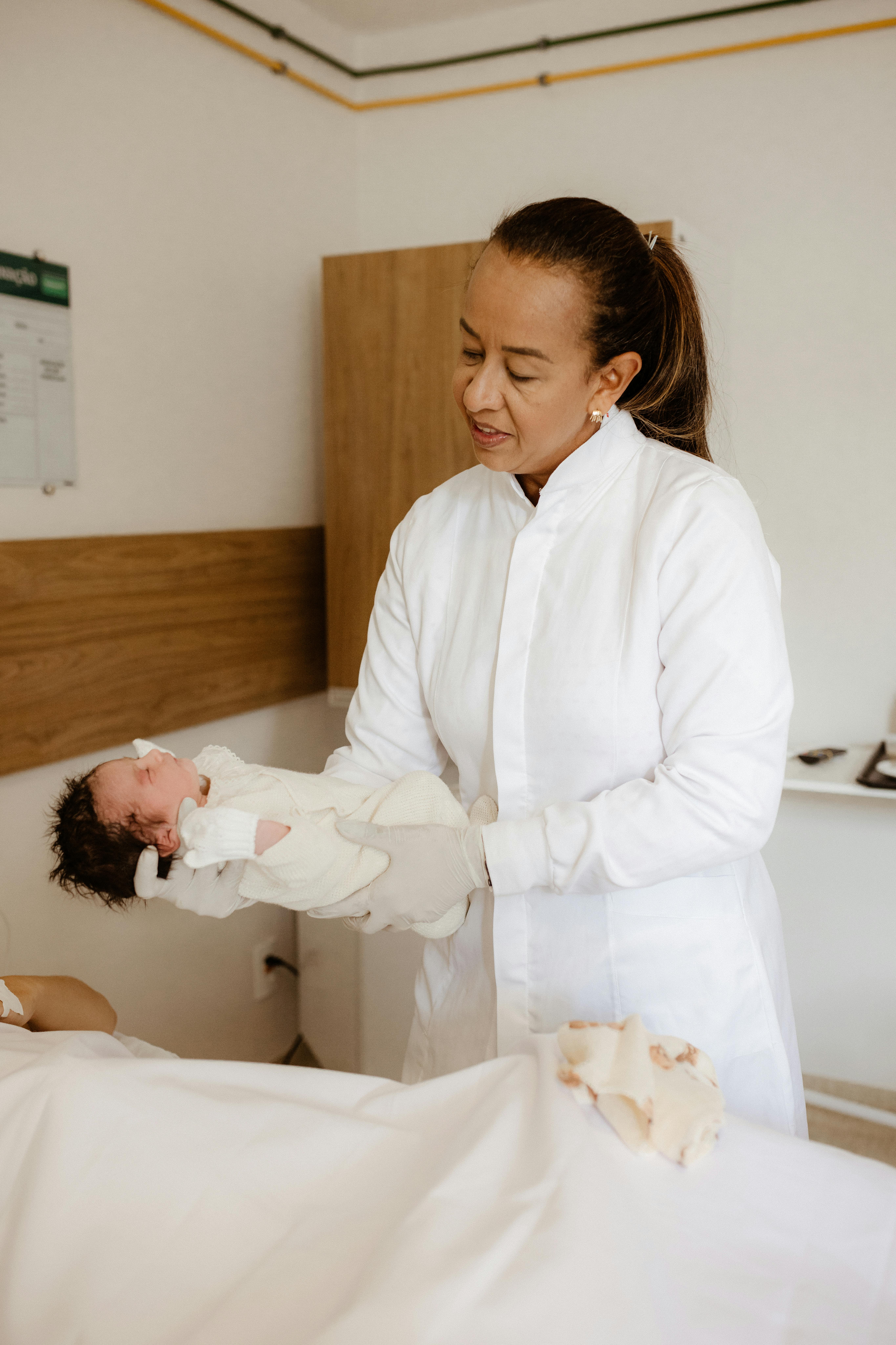Woman Carrying Baby · Free Stock Photo