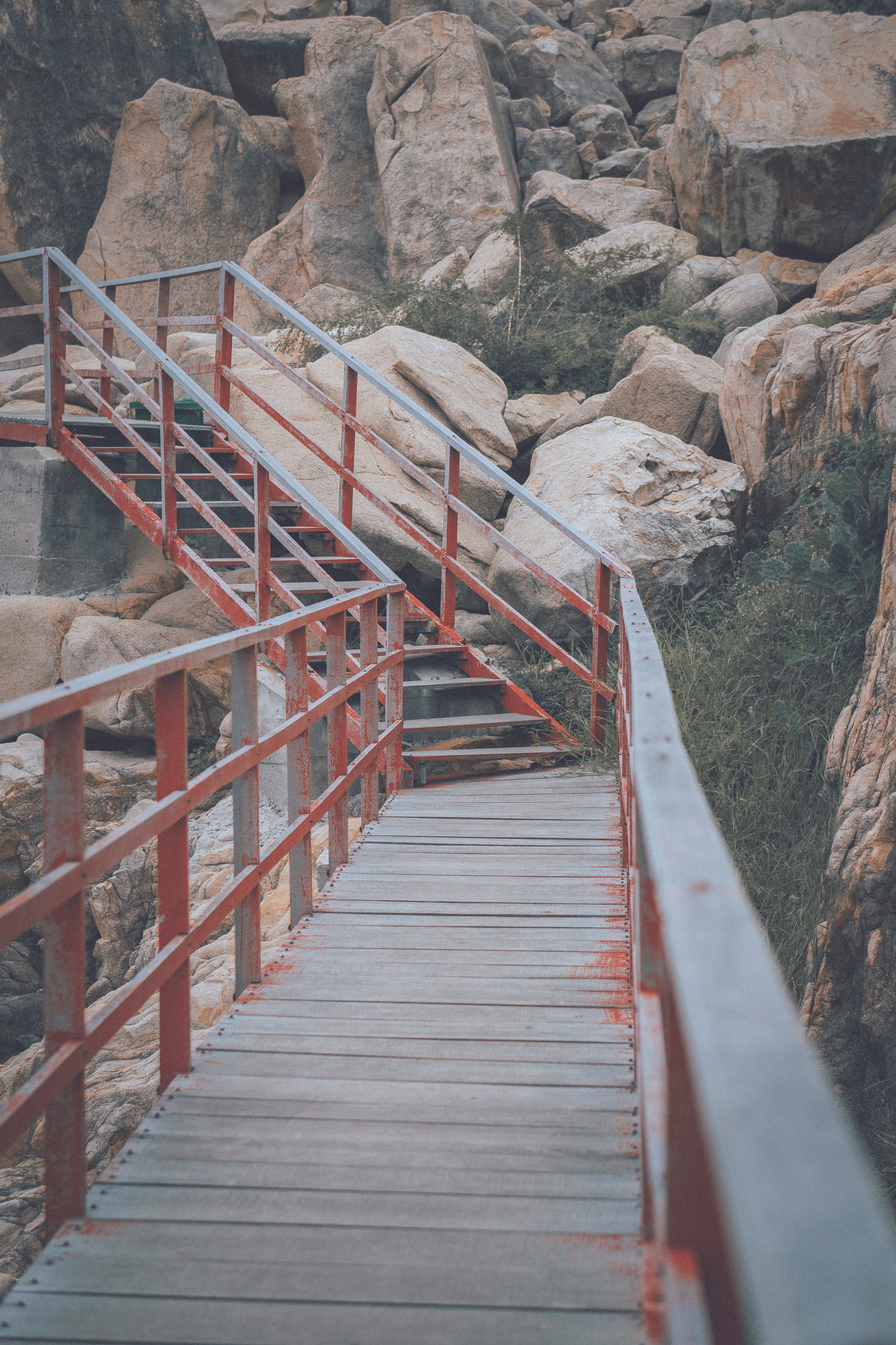 Wooden Boardwalk near Rocks · Free Stock Photo