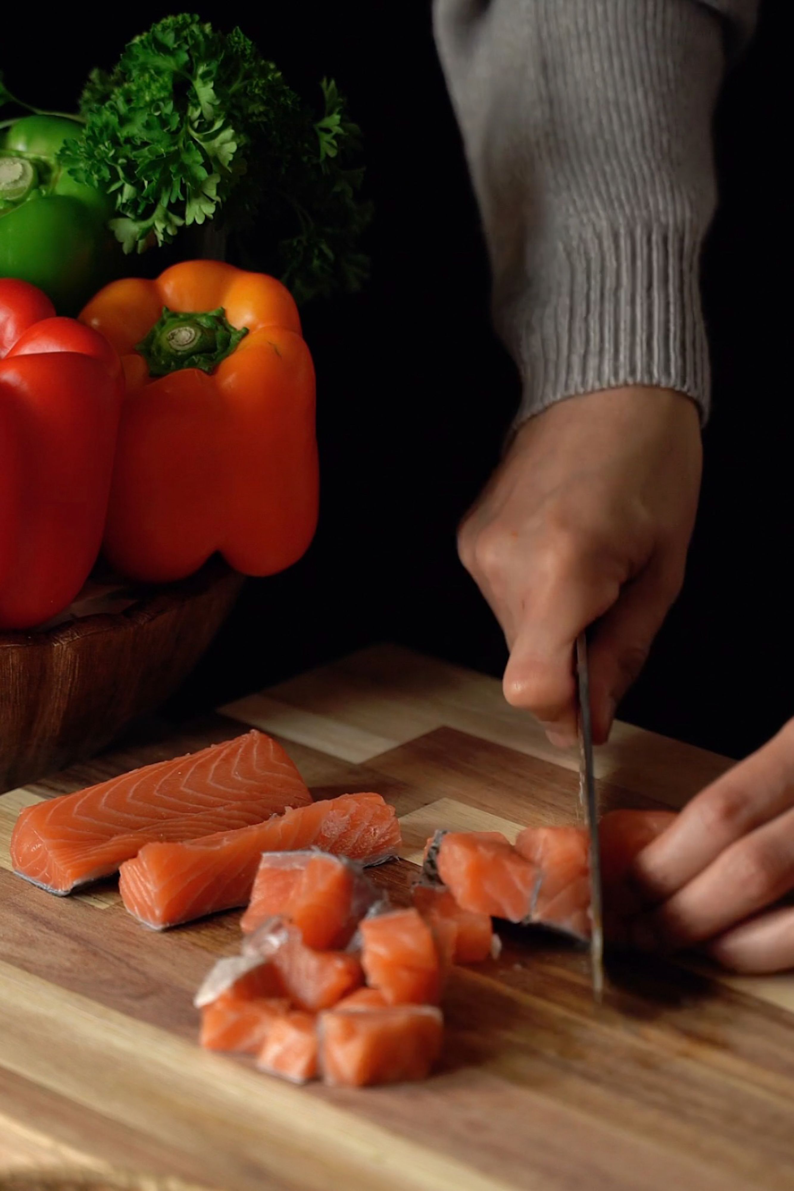 Person Slicing Meat On White Chopping Board · Free Stock Photo