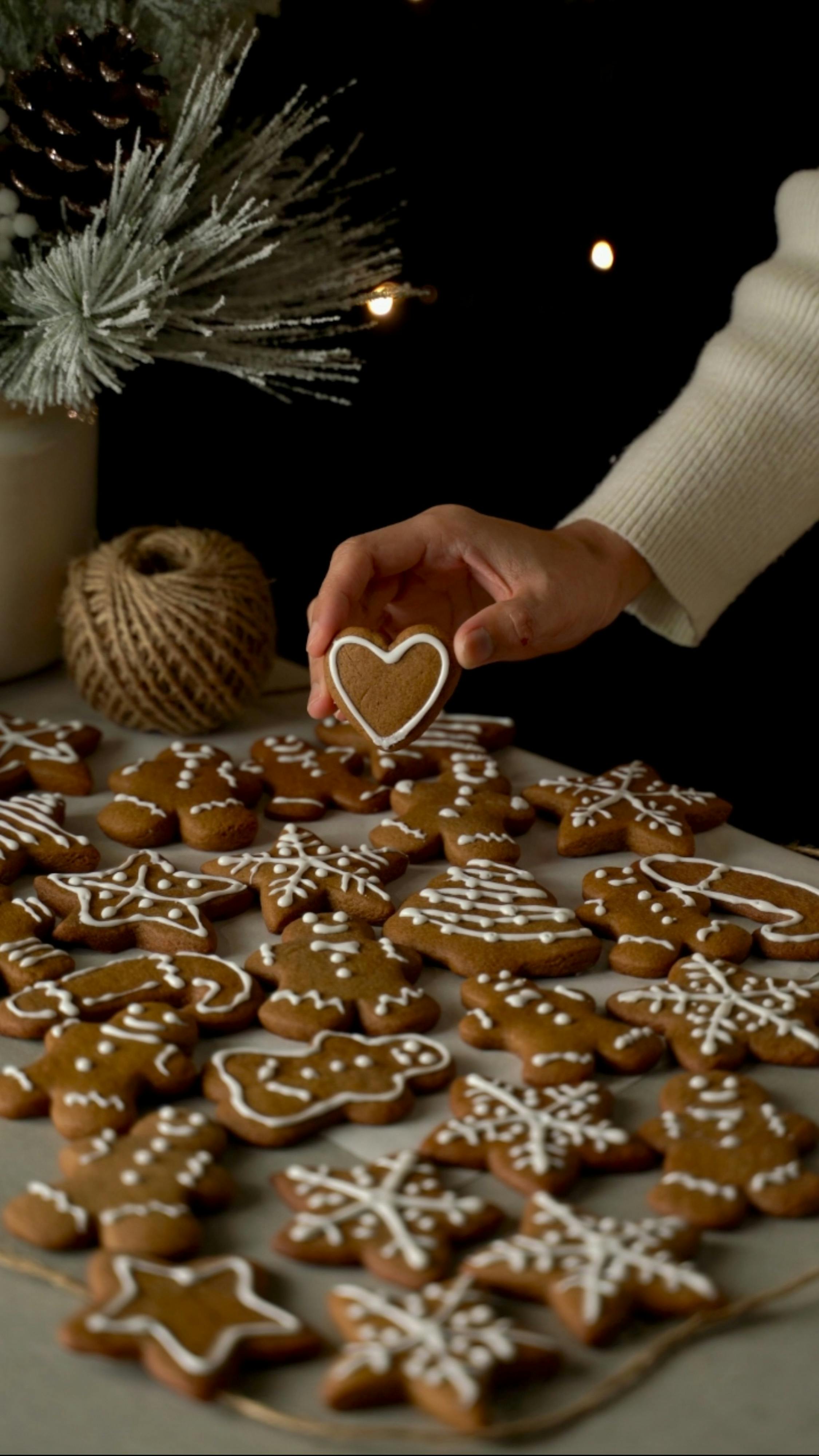 Woman Showing Decorated Christmas Cookies · Free Stock Photo