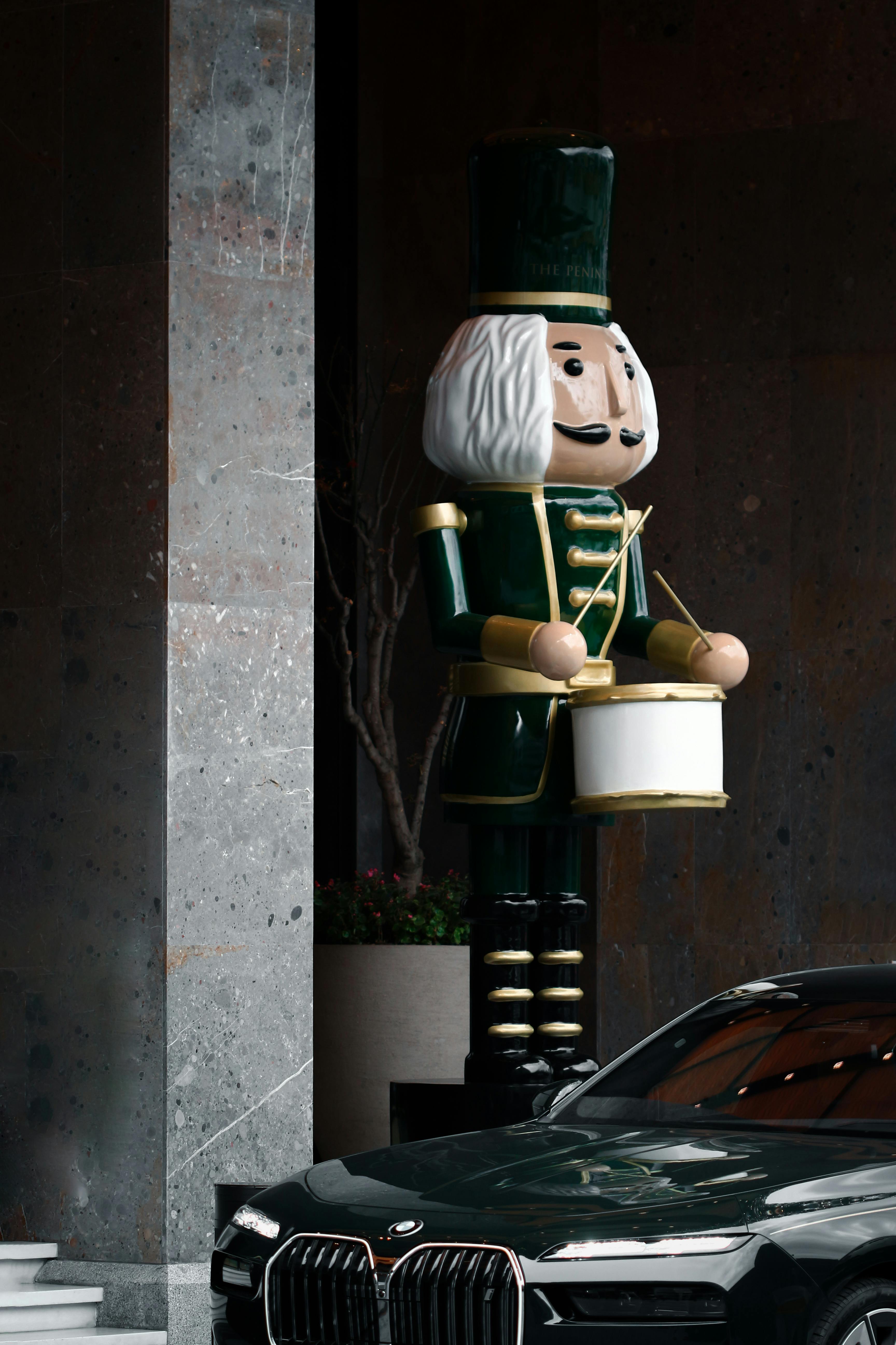 Nutcracker Statue near Car · Free Stock Photo