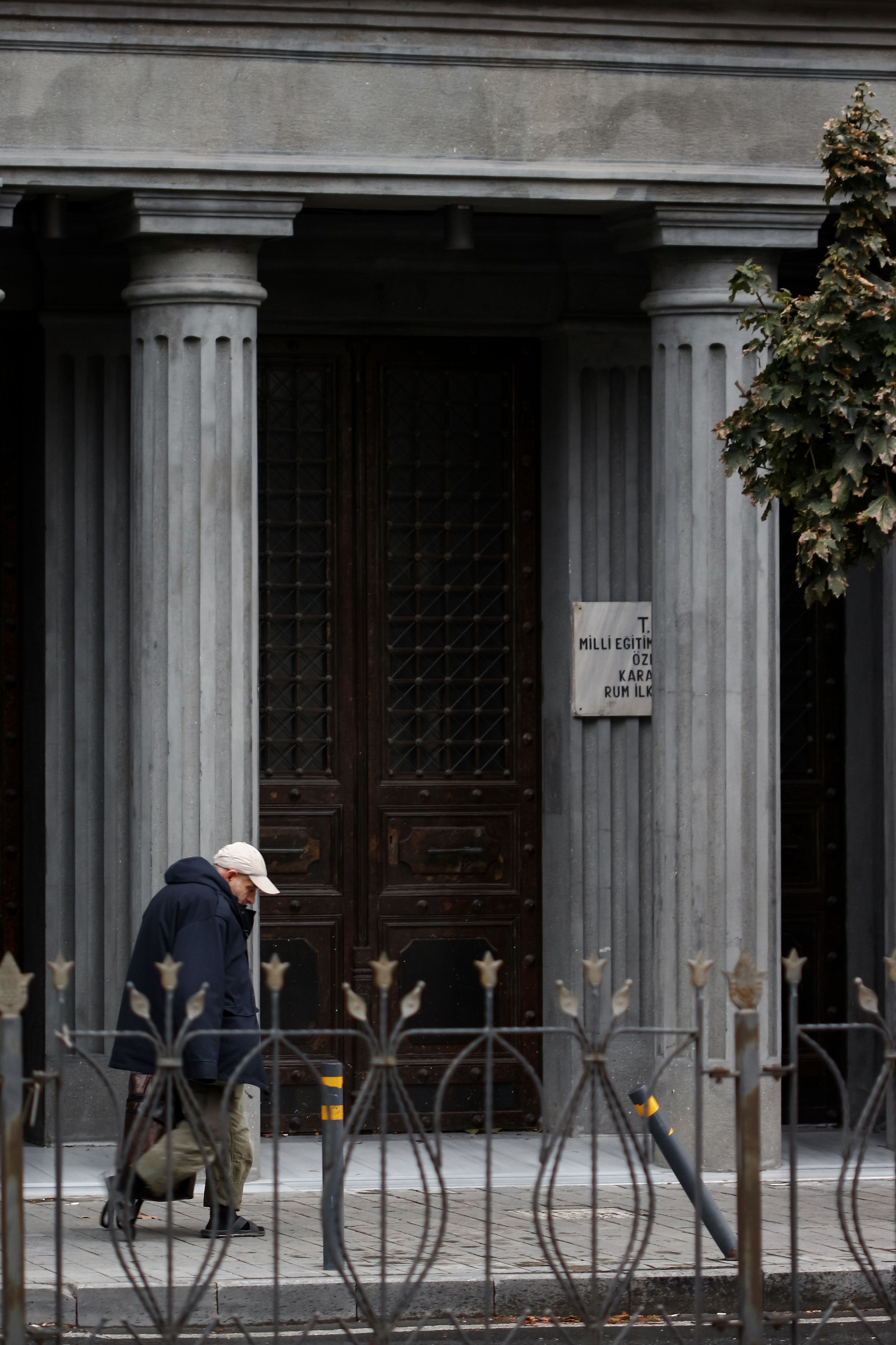Elderly Hunched Man Walking in Passing by Galata Greek School in ...