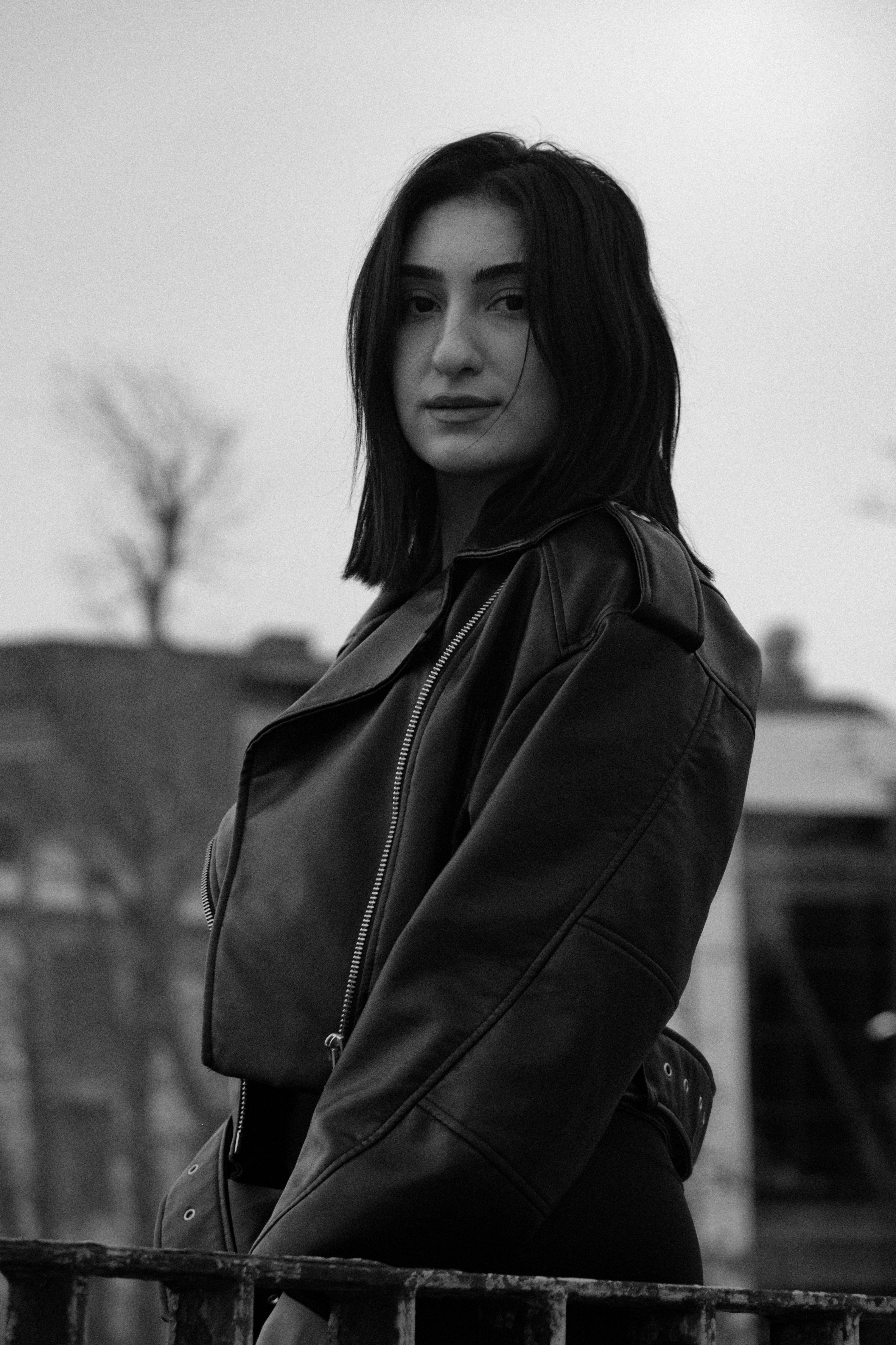 Woman in Unzipped Jacket on Grassland · Free Stock Photo
