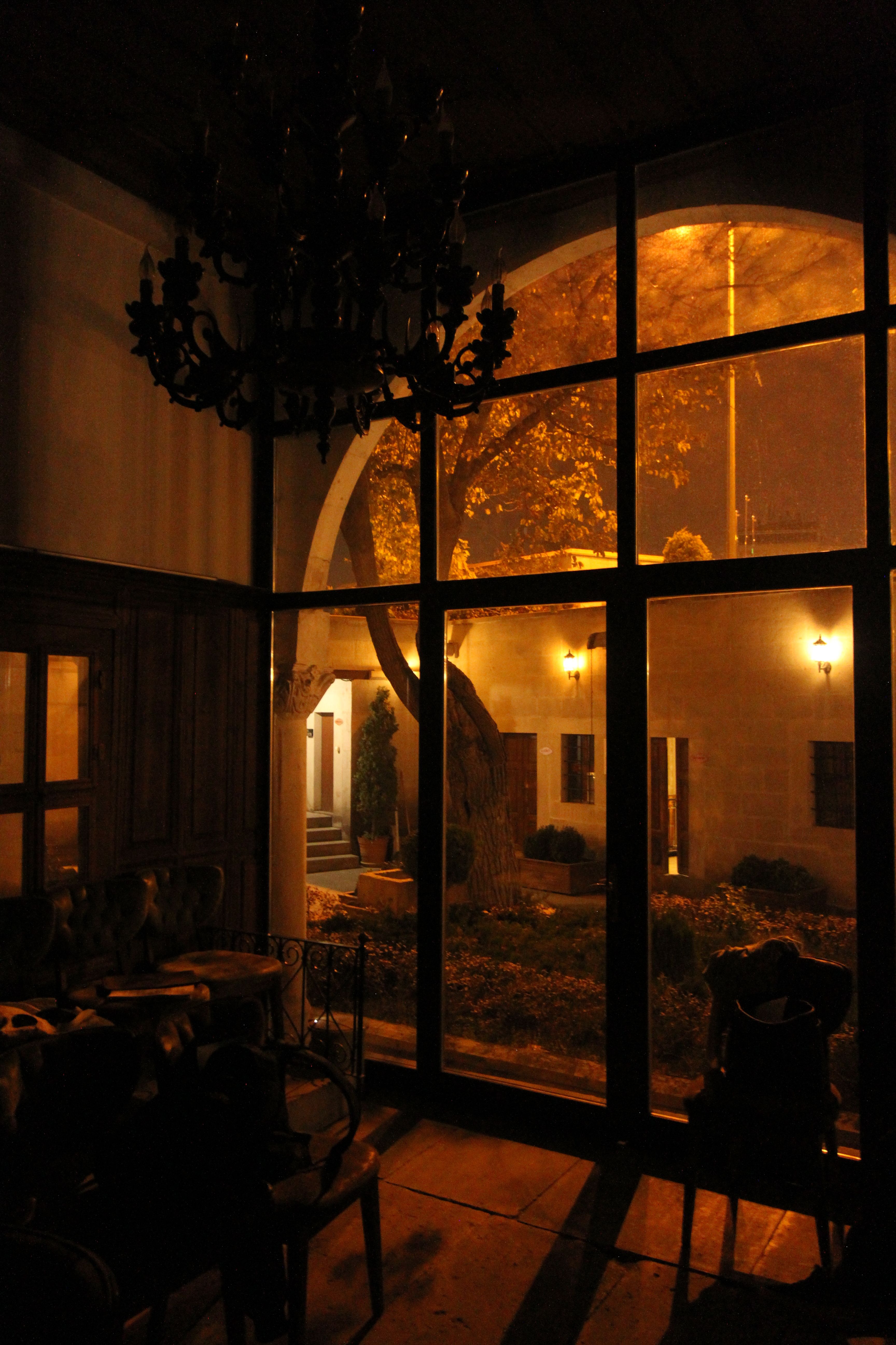 Warm Light from the Street Illuminating a Room through a Big Window ...