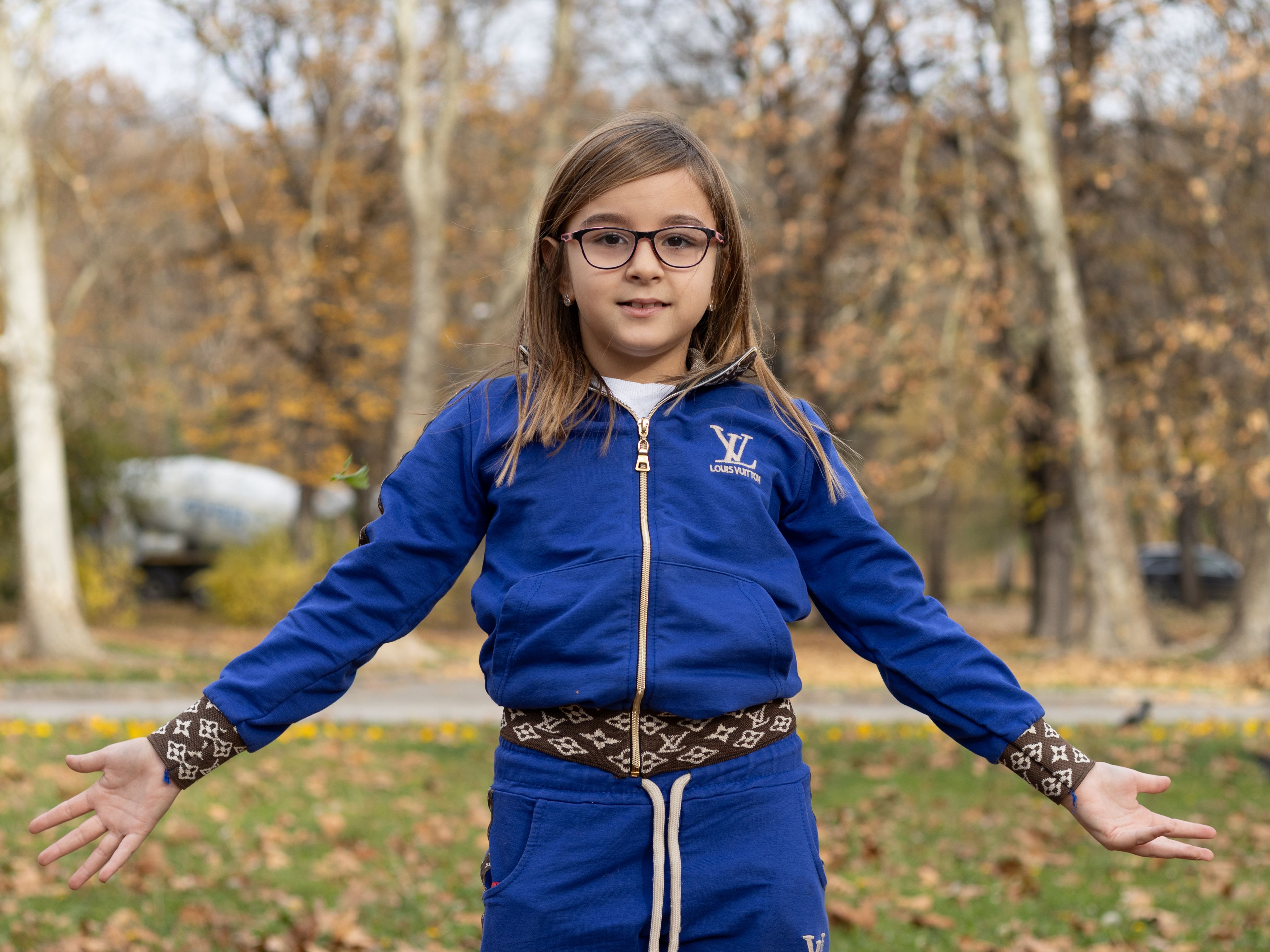 Child Model in Sportswear in Autumn Park · Free Stock Photo