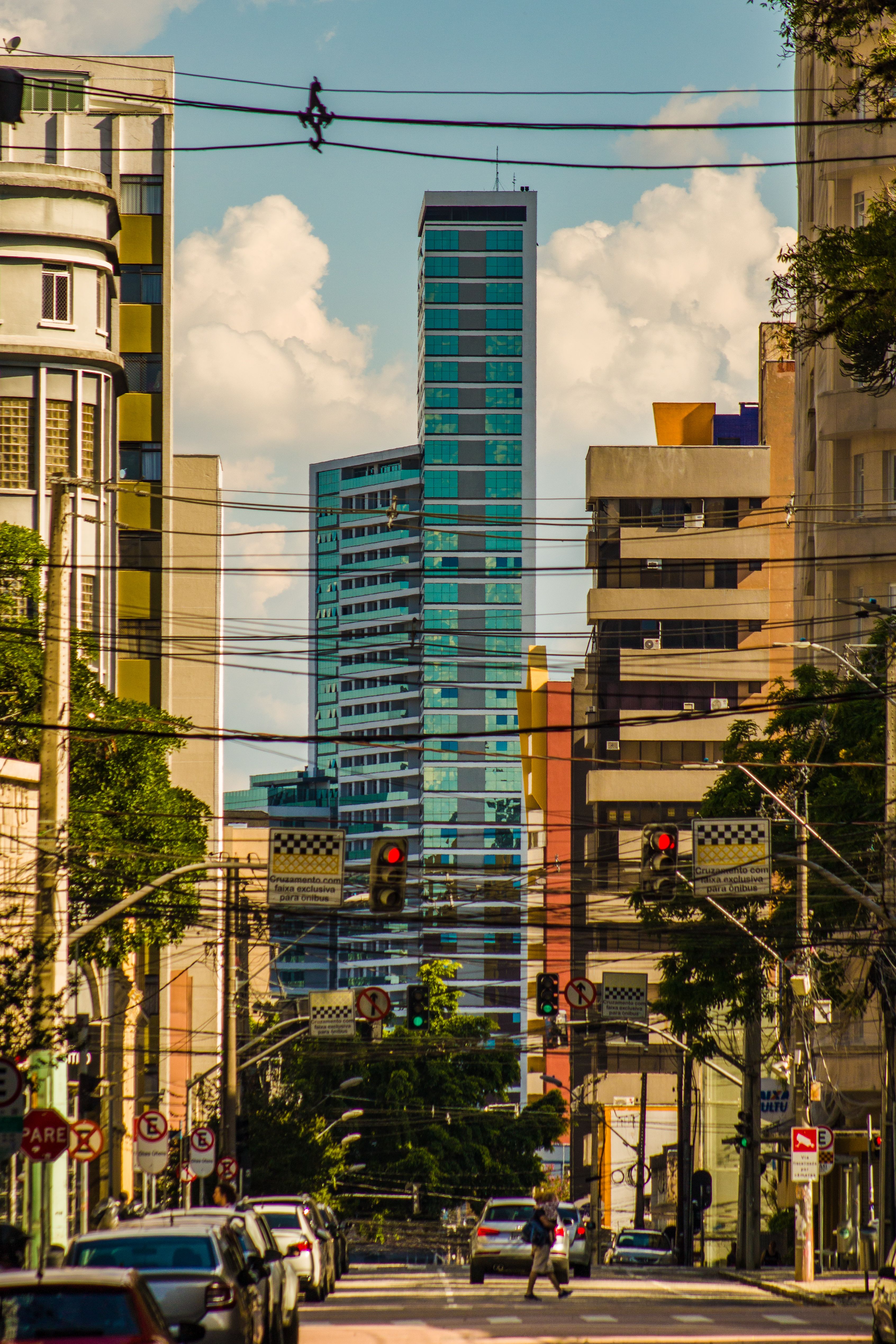 City Street with a Tall Skyscraper in the Background · Free Stock Photo