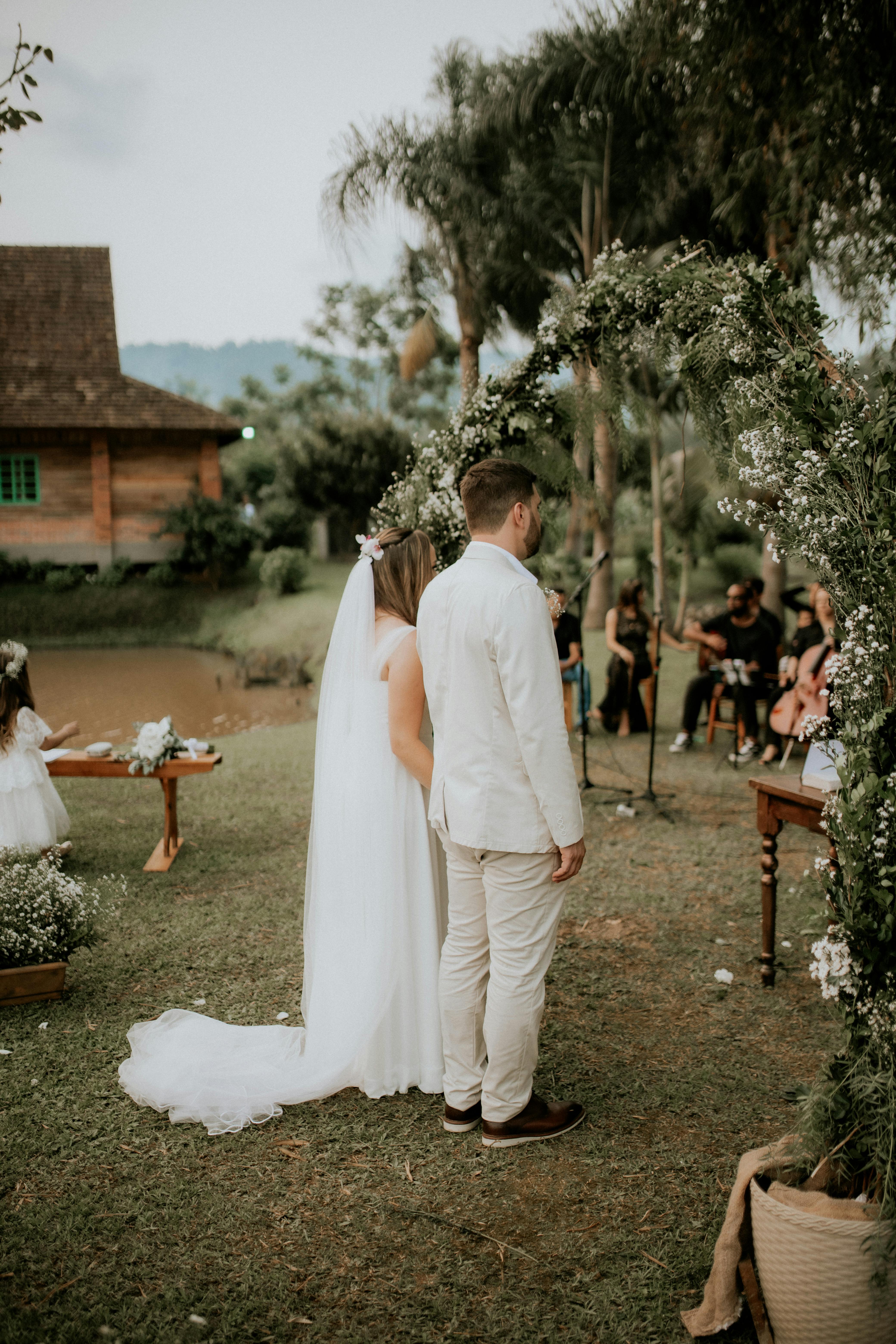 Young Couple Standing Together during a Wedding Ceremony · Free Stock Photo
