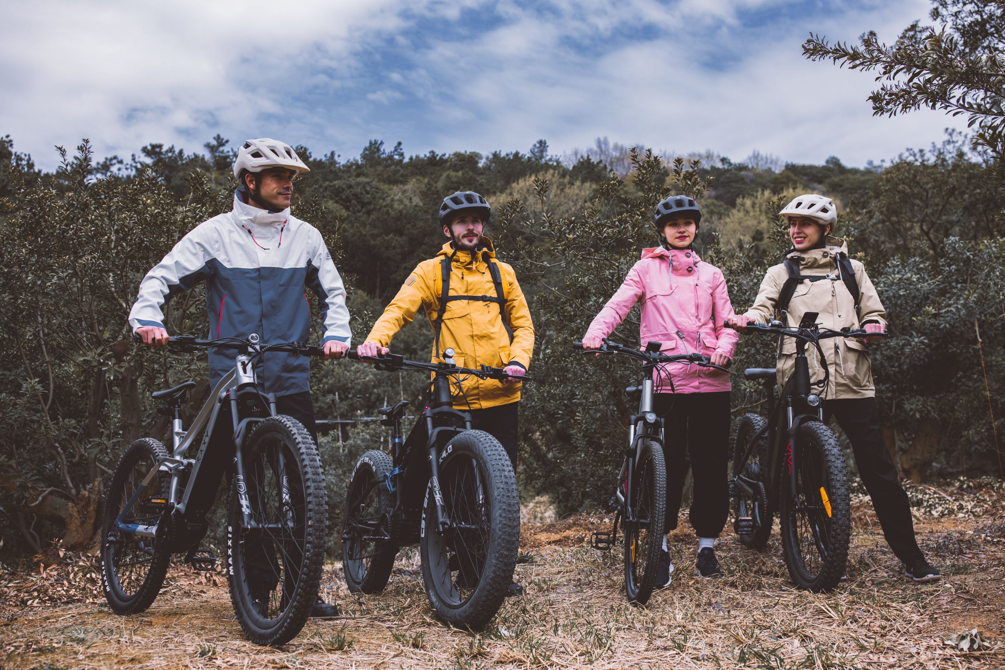 A Group of People Standing with Bikes · Free Stock Photo