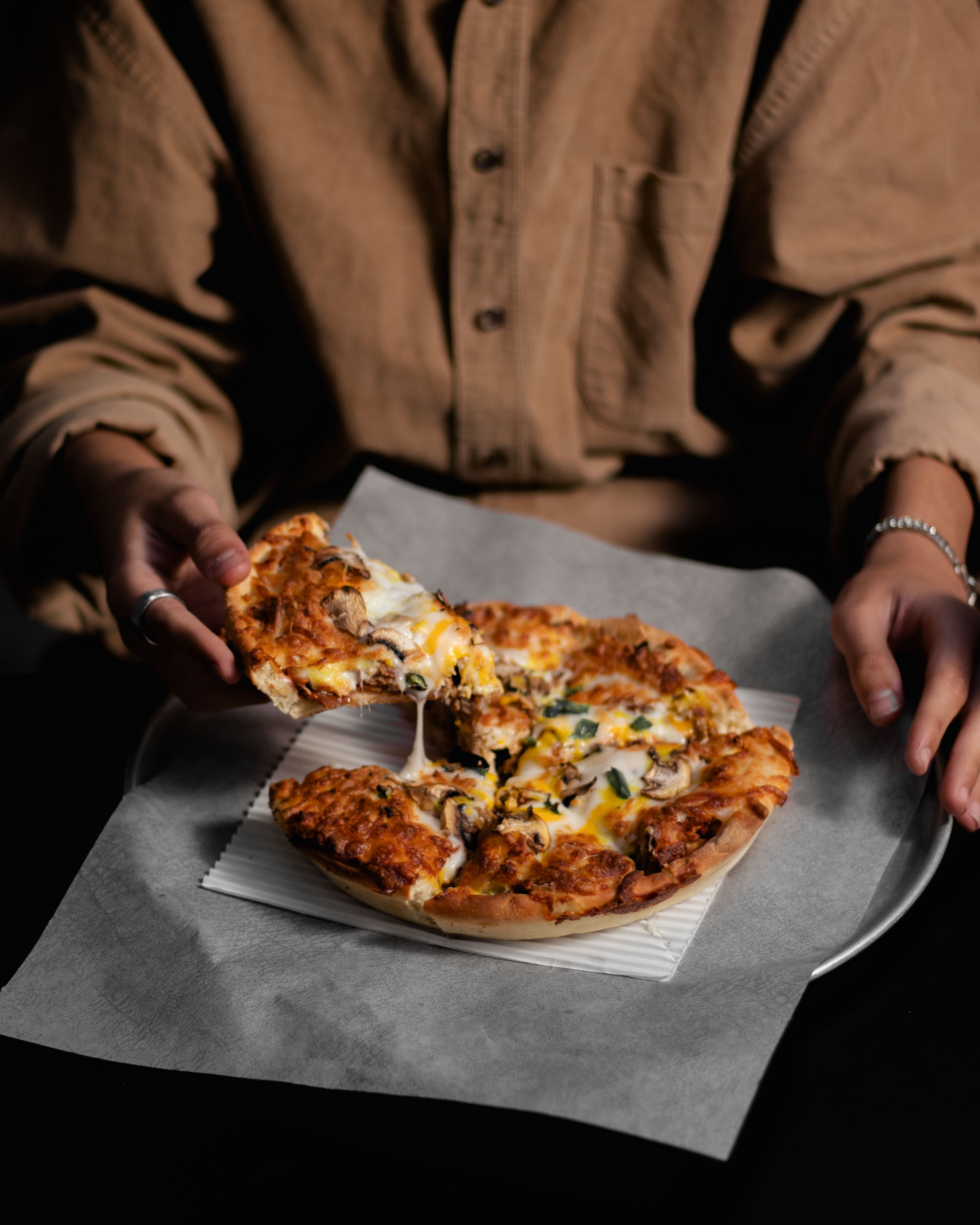 Close-up of a Person Grabbing Food from the Table with Chopsticks ...