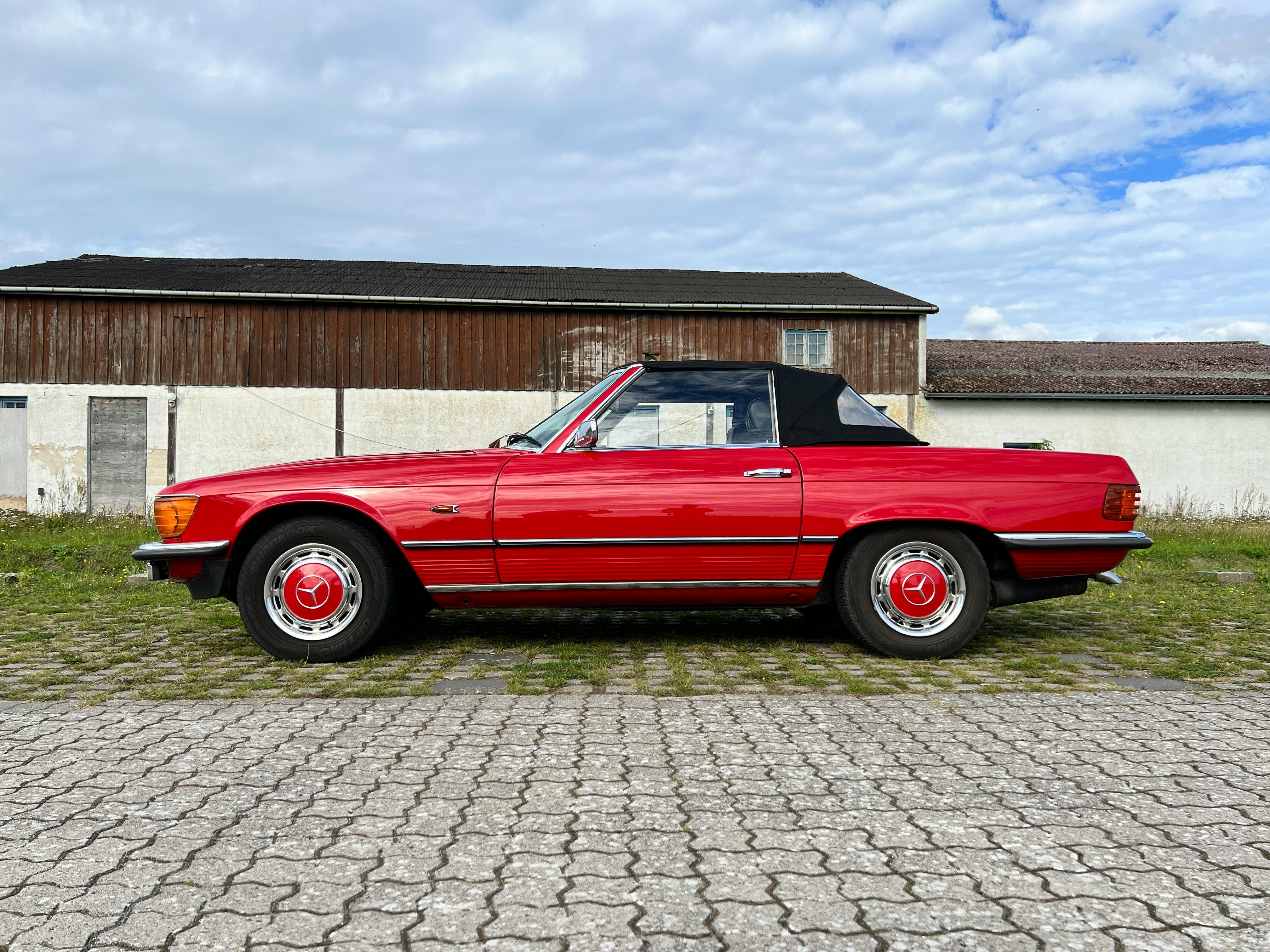 Red Mercedes R107 in Village · Free Stock Photo
