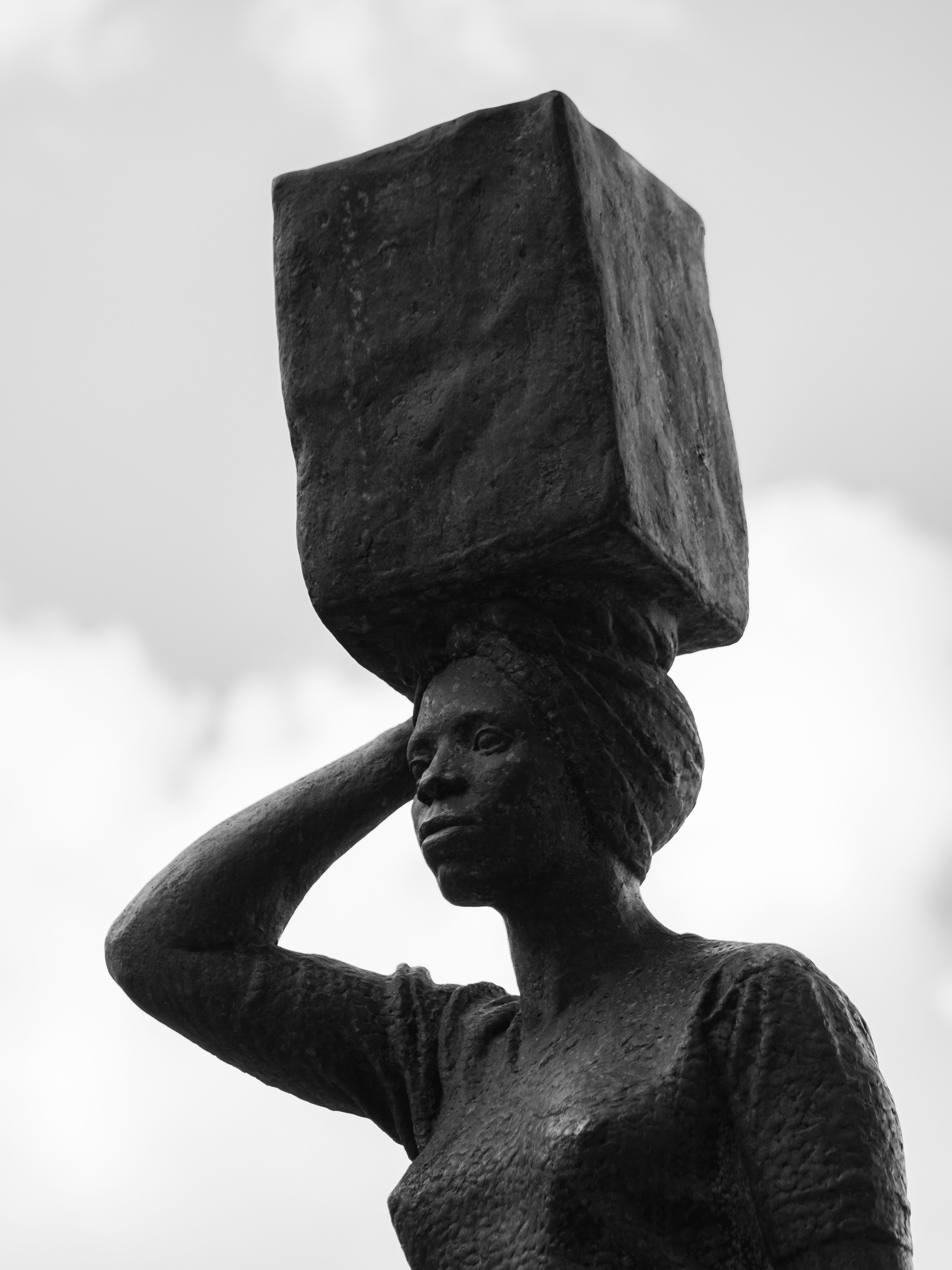 Statue of a Woman Carrying a Box on Her Head · Free Stock Photo