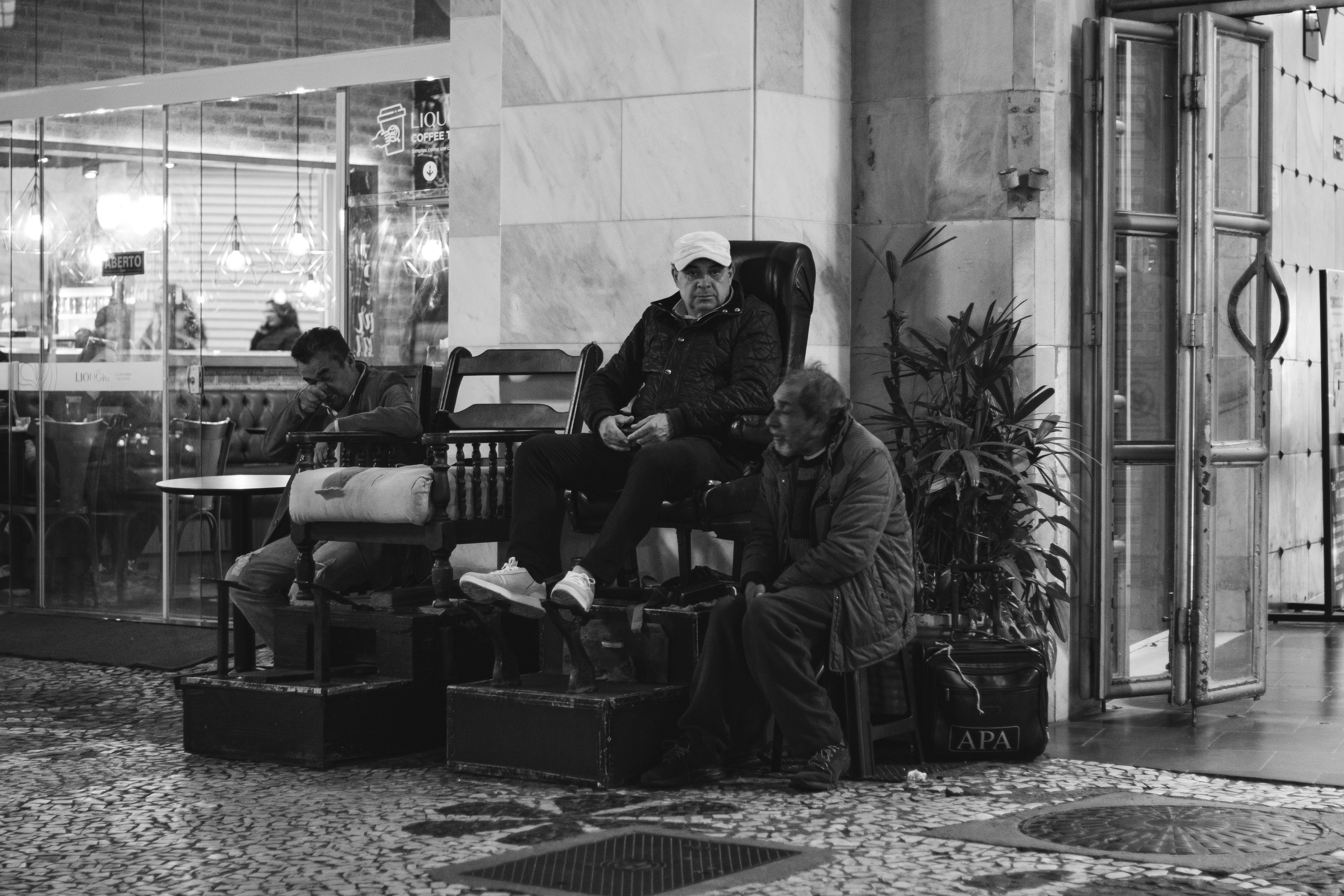 Men Sitting Outside of a Building in City · Free Stock Photo