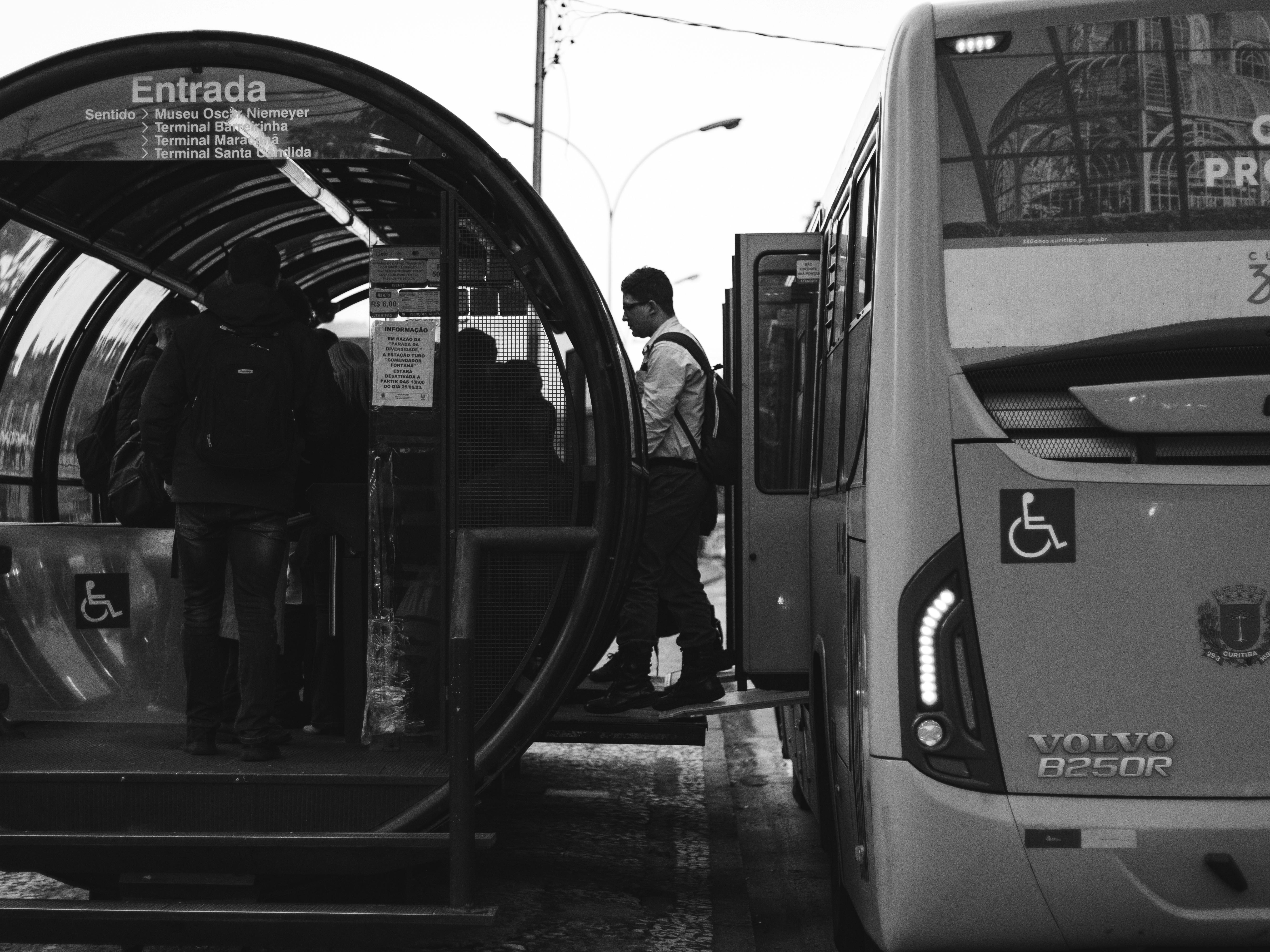 People Getting Out of a Bus at the Bus Stop · Free Stock Photo