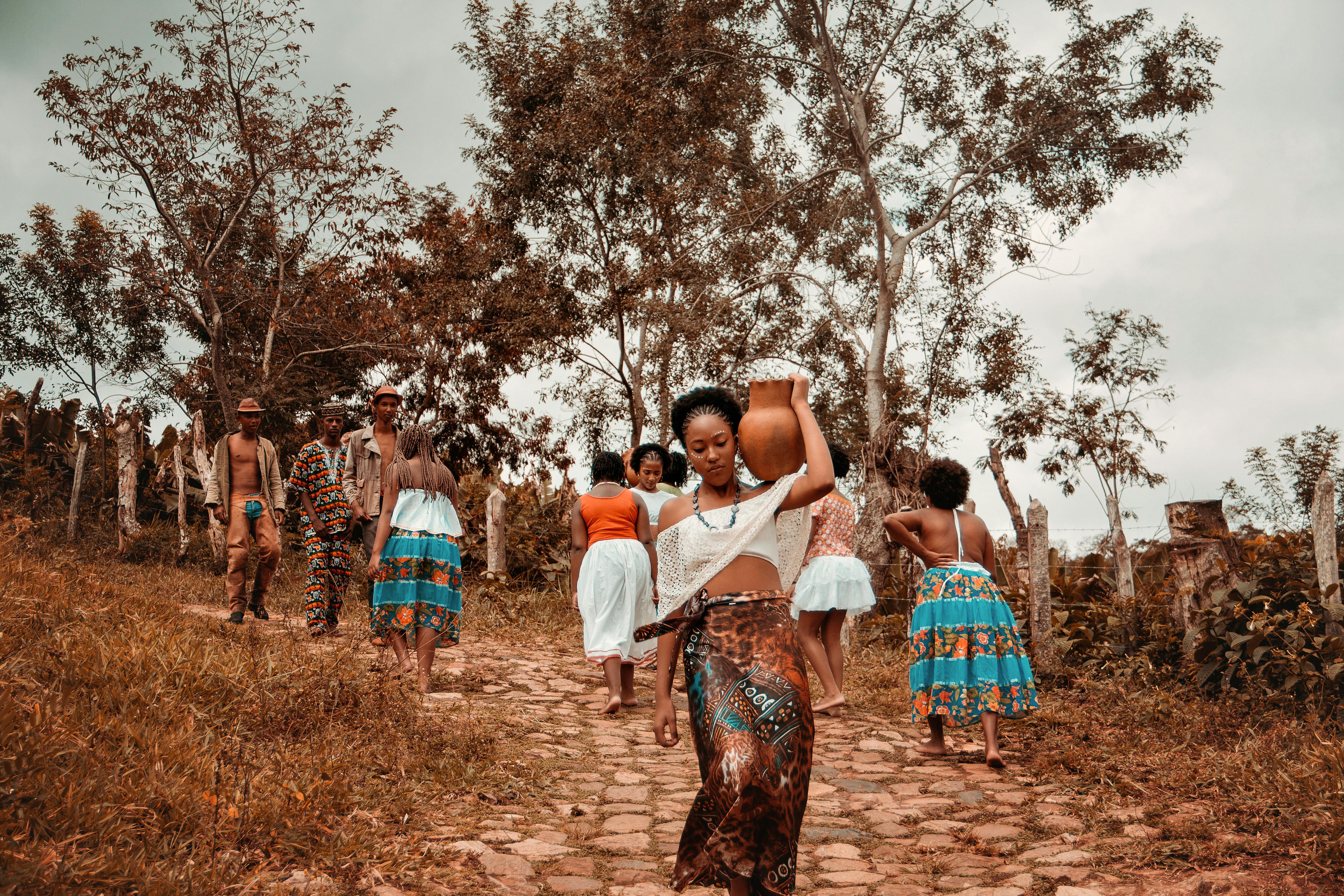 Women and Men Walking in Village · Free Stock Photo