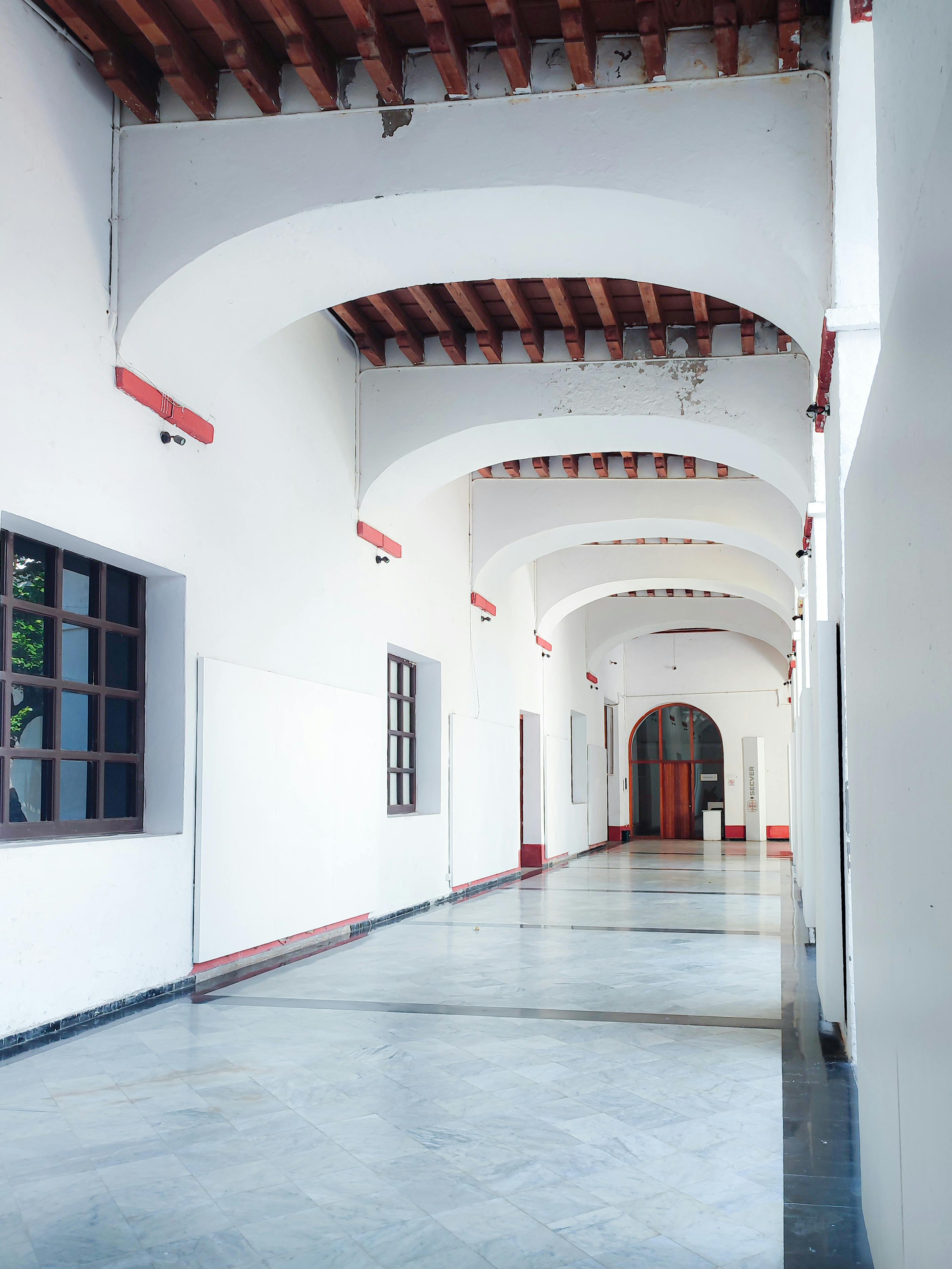 Lights in Corridor with Pictures on Walls · Free Stock Photo