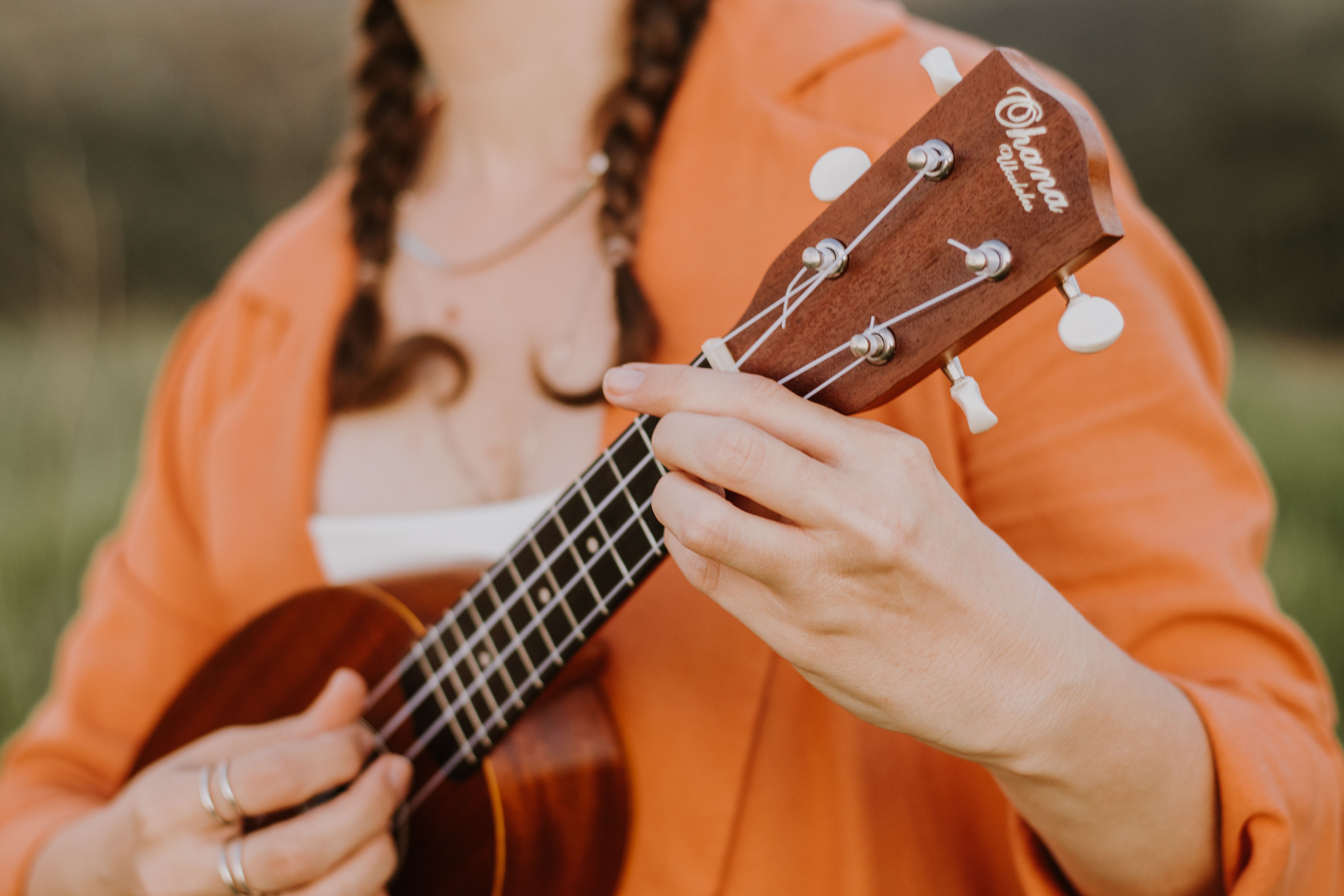 Hands of a Young Woman Playing a Ukulele · Free Stock Photo