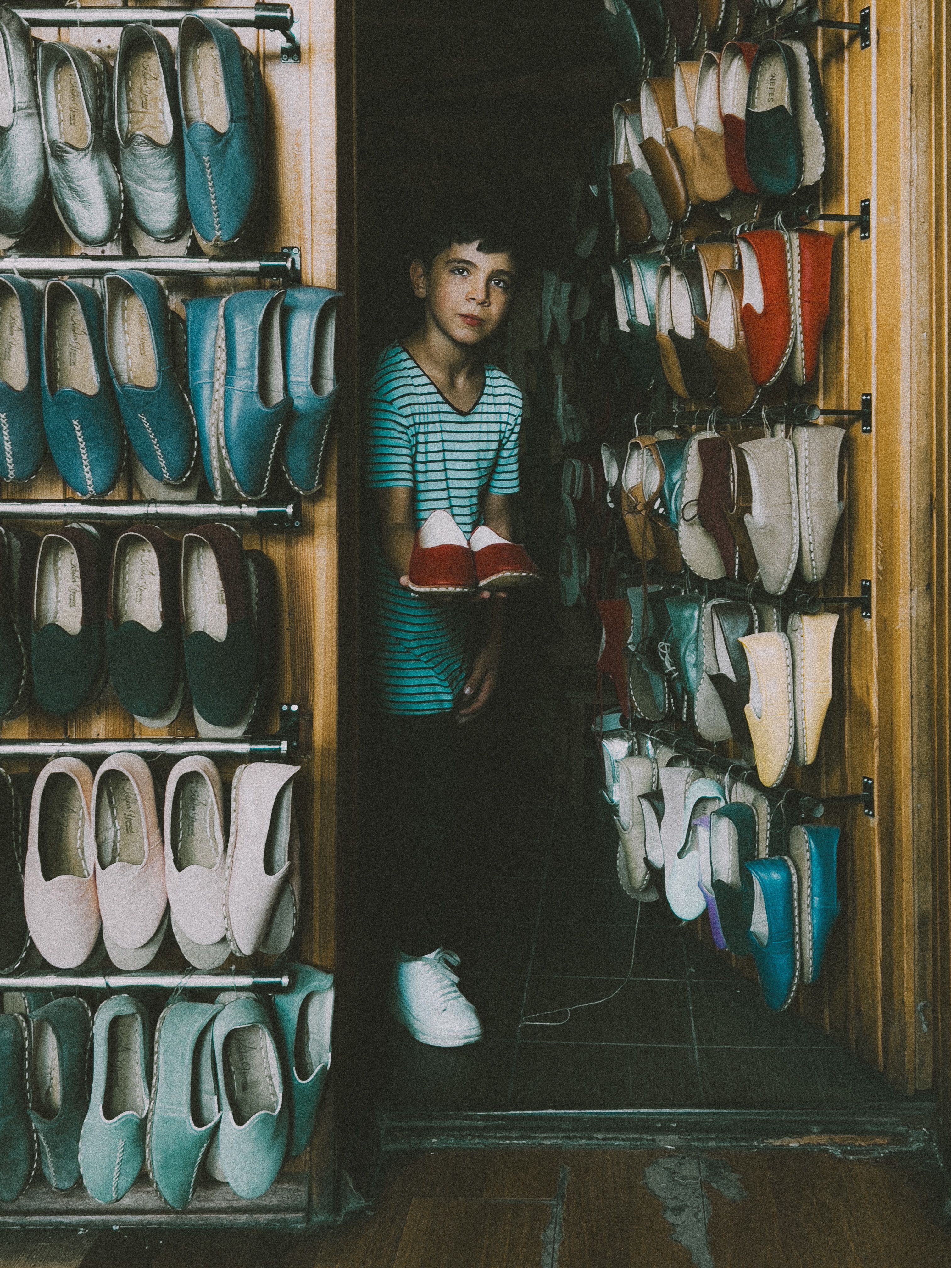 Boy Standing in Entrance to Sheo-Shop · Free Stock Photo