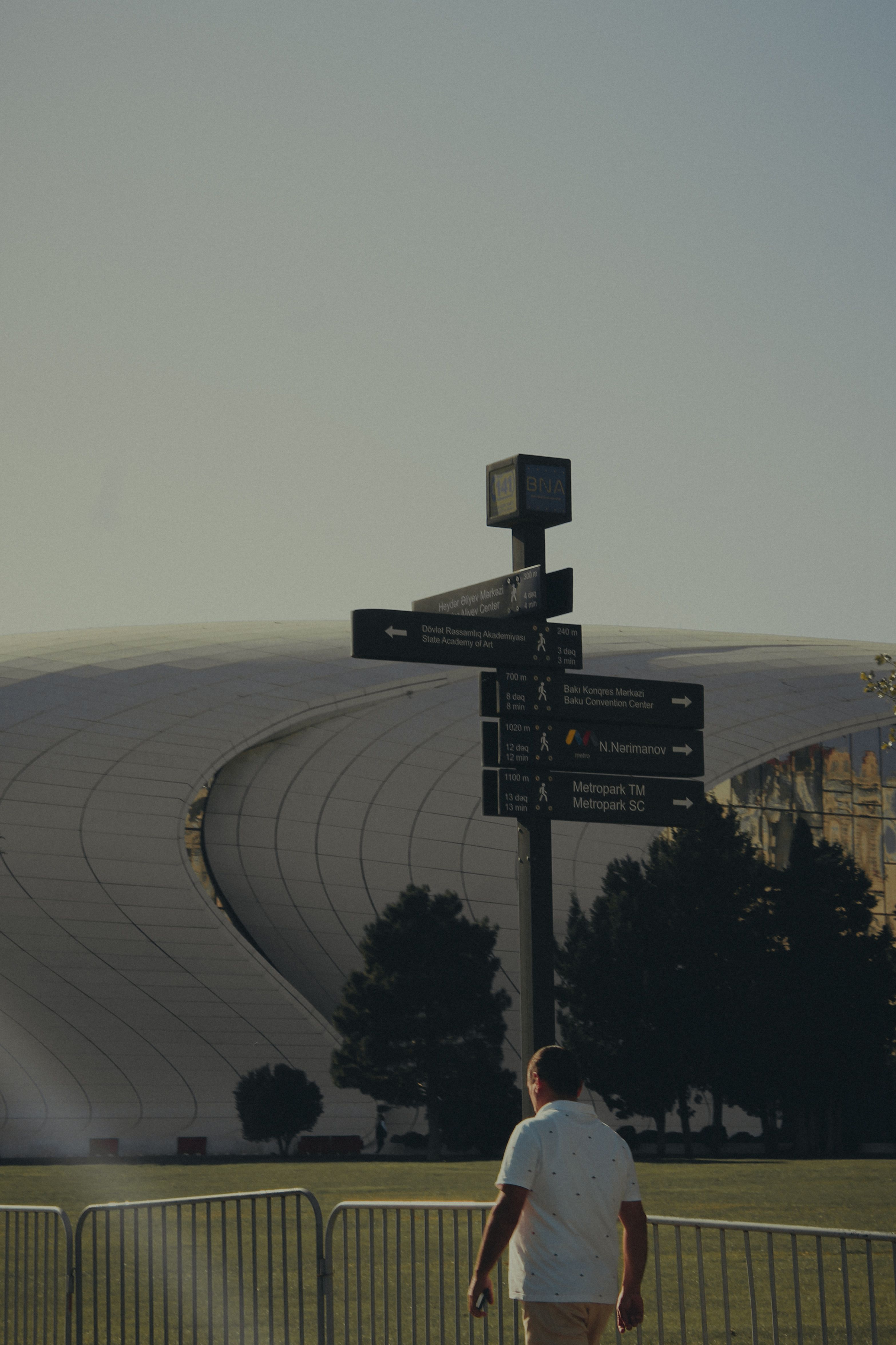 A Person Standing by a Signpost · Free Stock Photo