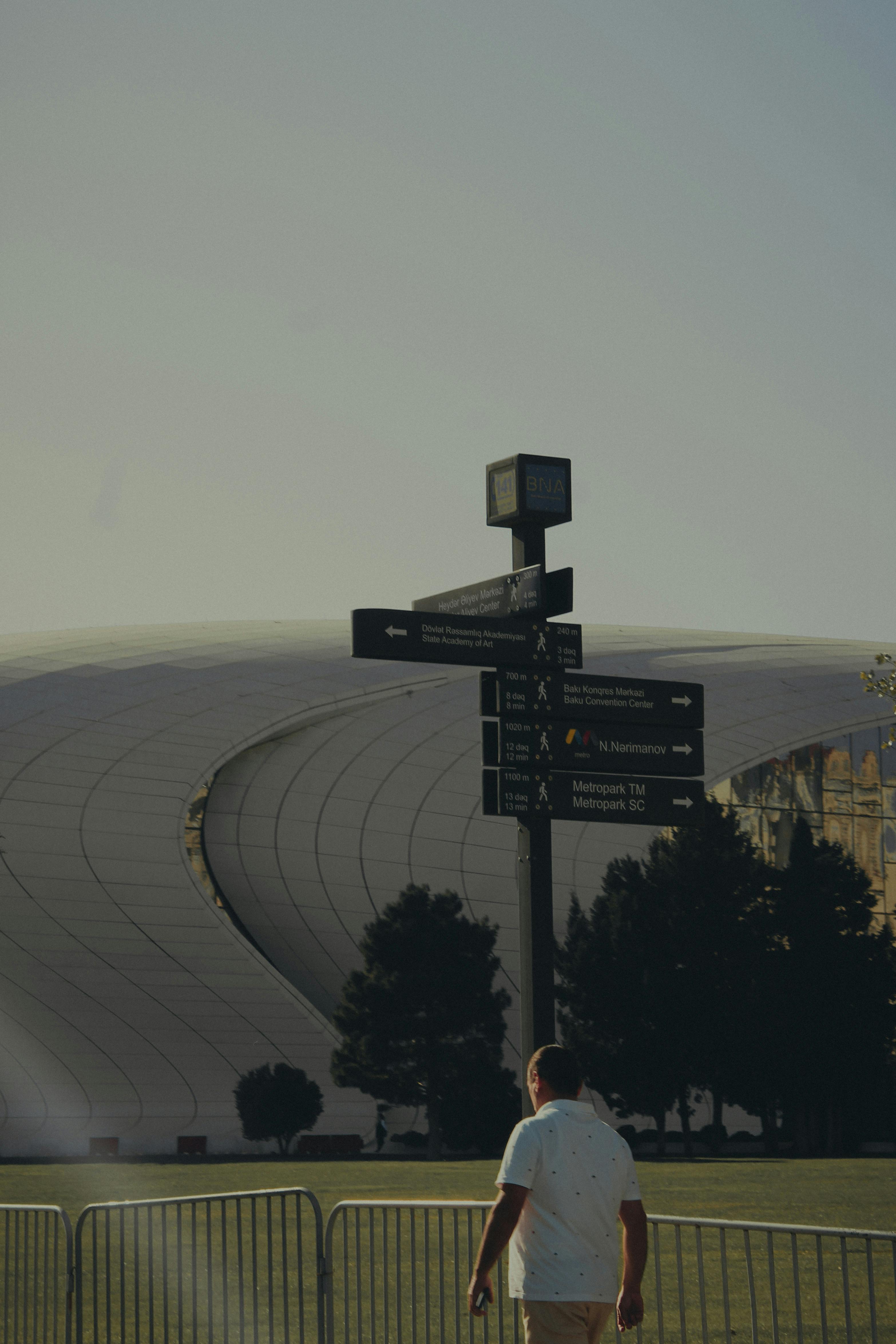 A Person Standing by a Signpost · Free Stock Photo