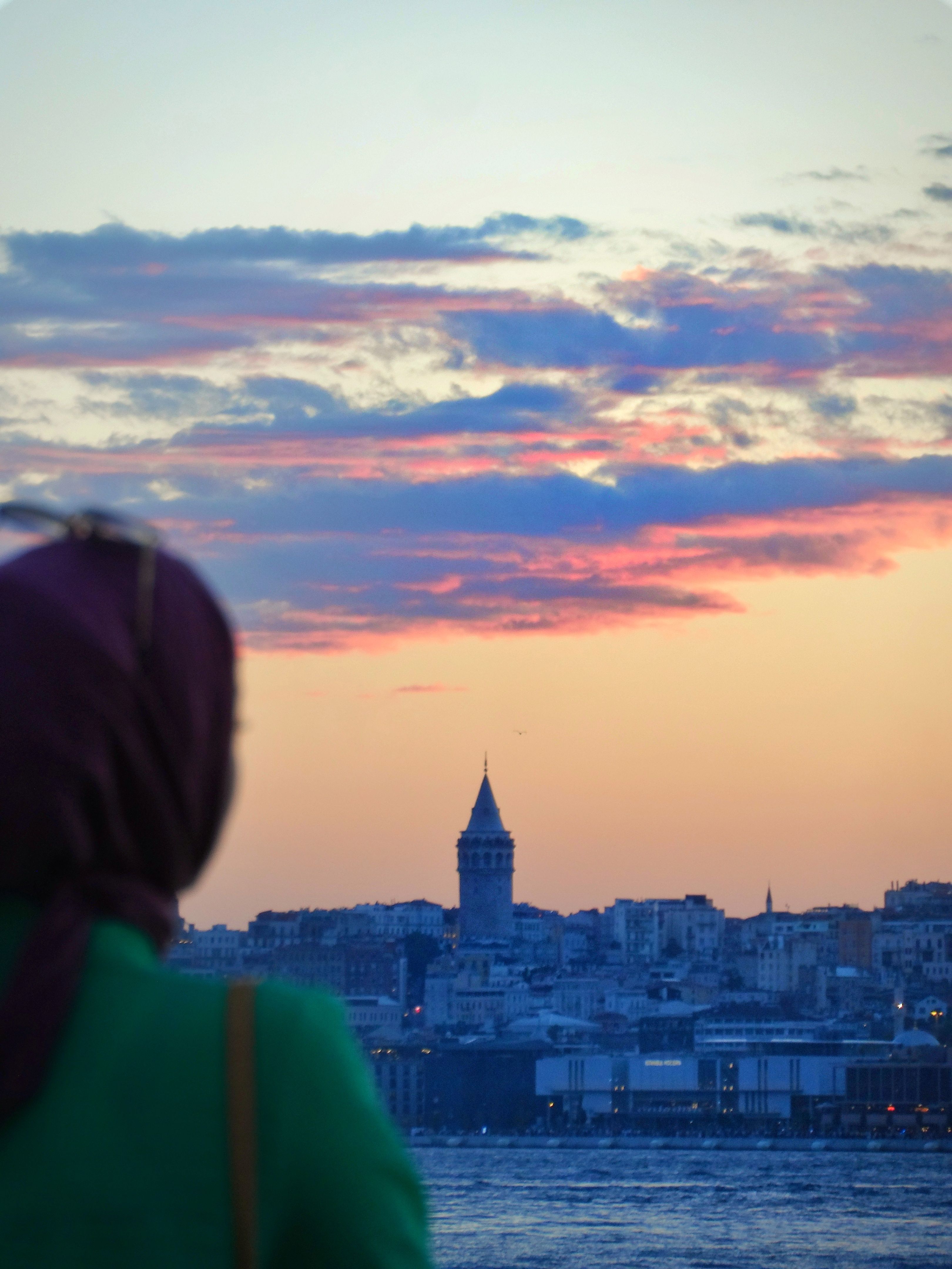 Galata Tower behind Woman in Hijab at Sunset · Free Stock Photo