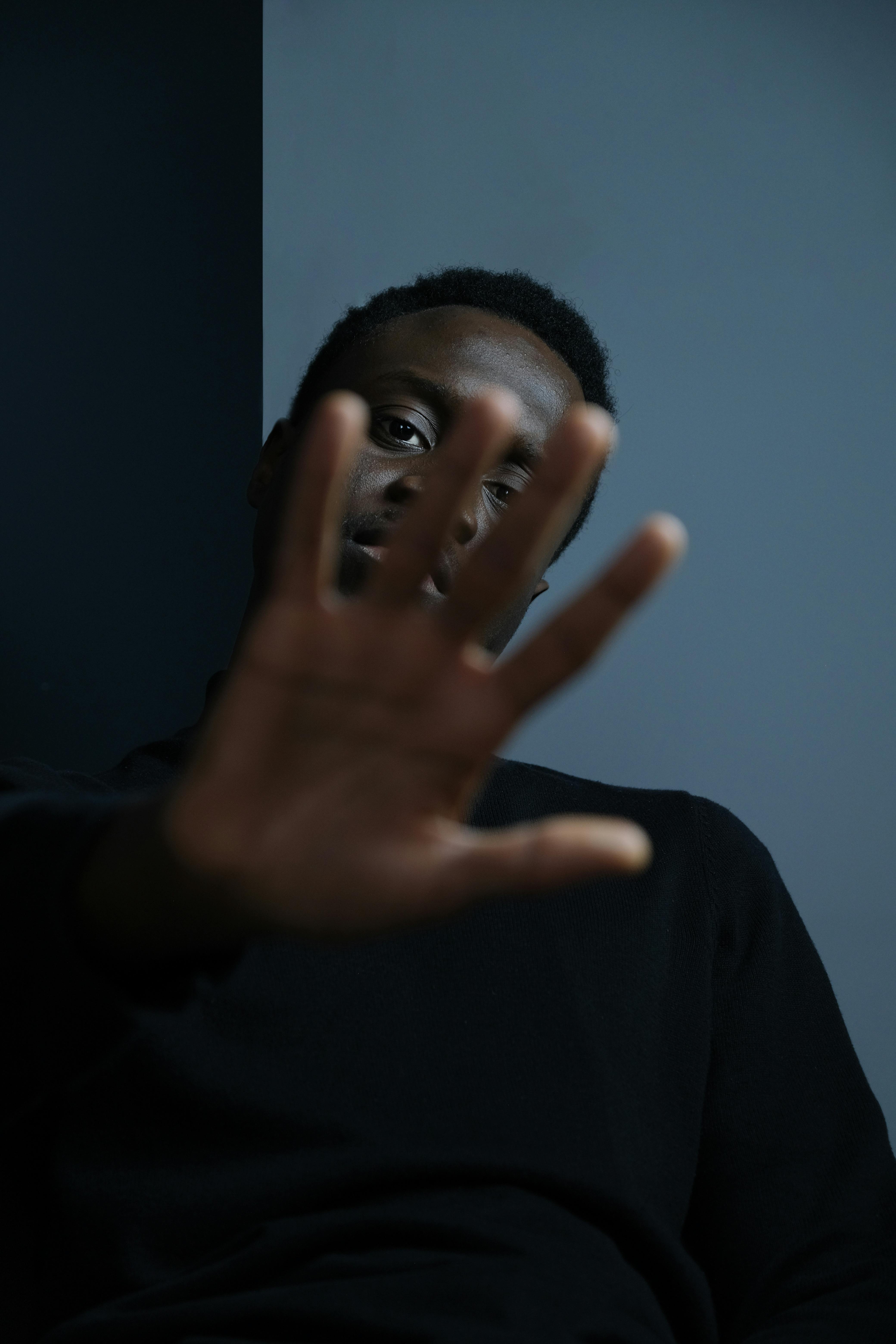 Man with Hand Raised · Free Stock Photo