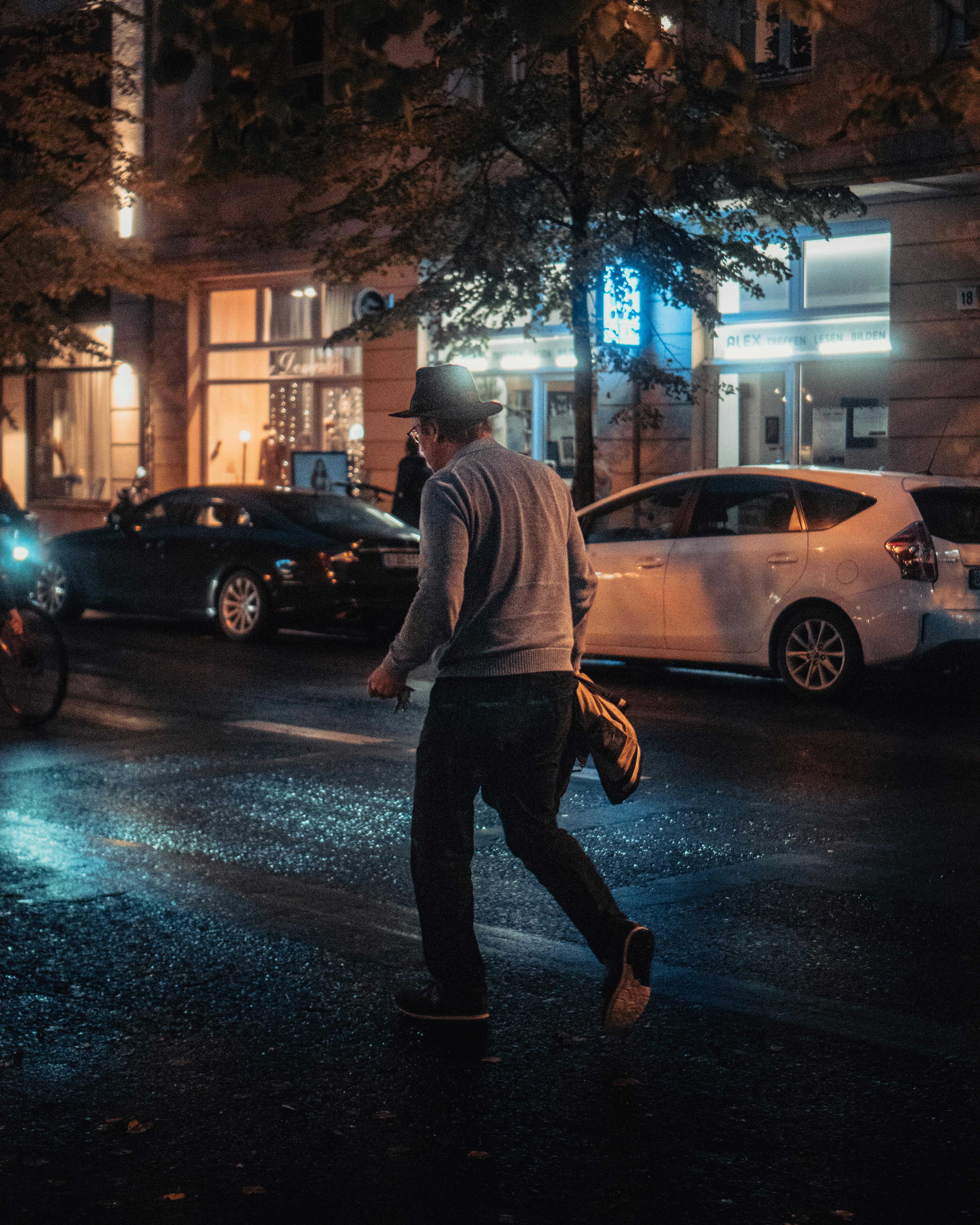 Man Walking on a Street at Night · Free Stock Photo