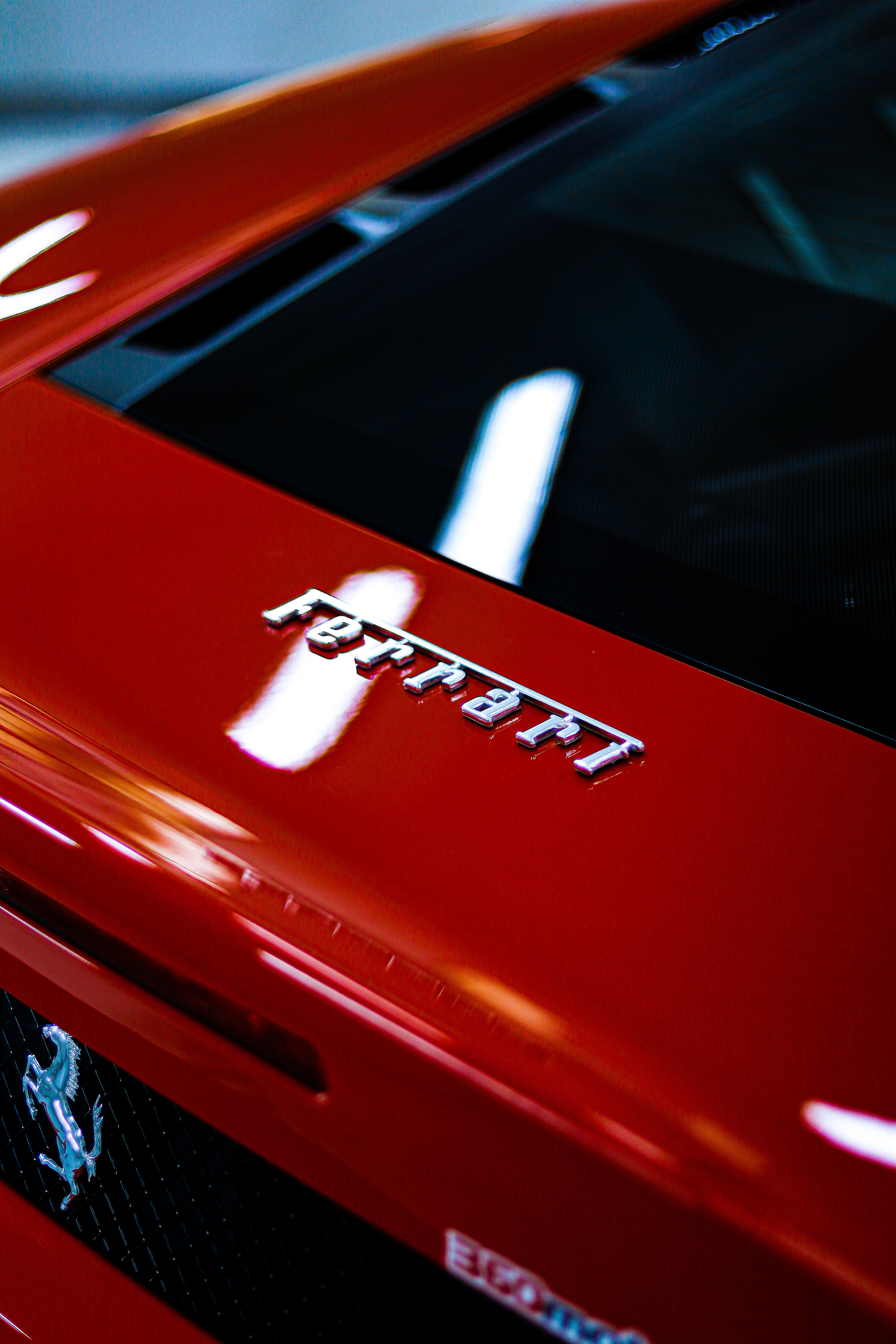 Expensive coupe car with brand name and badge · Free Stock Photo