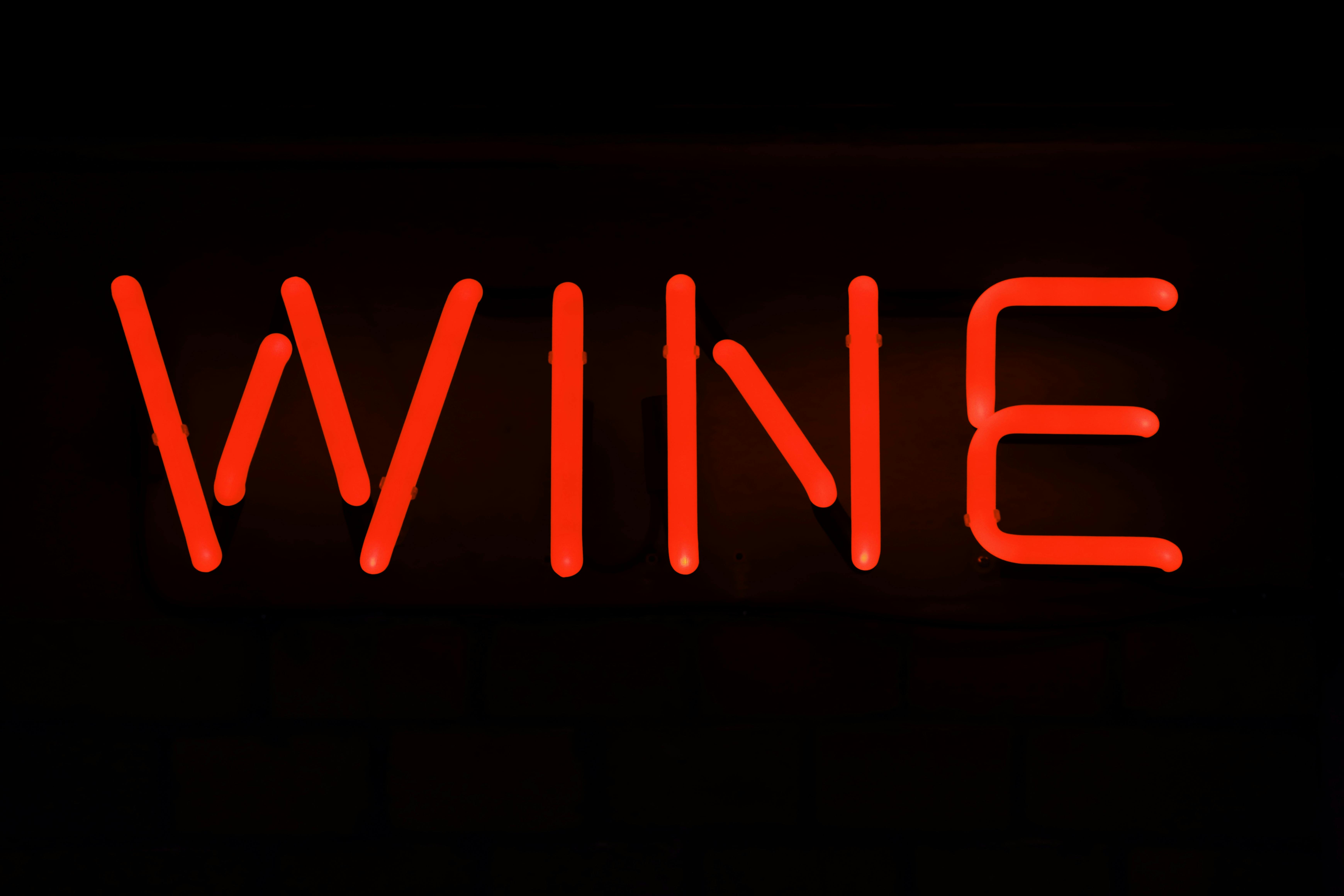 Neon Light Signage on Wall · Free Stock Photo