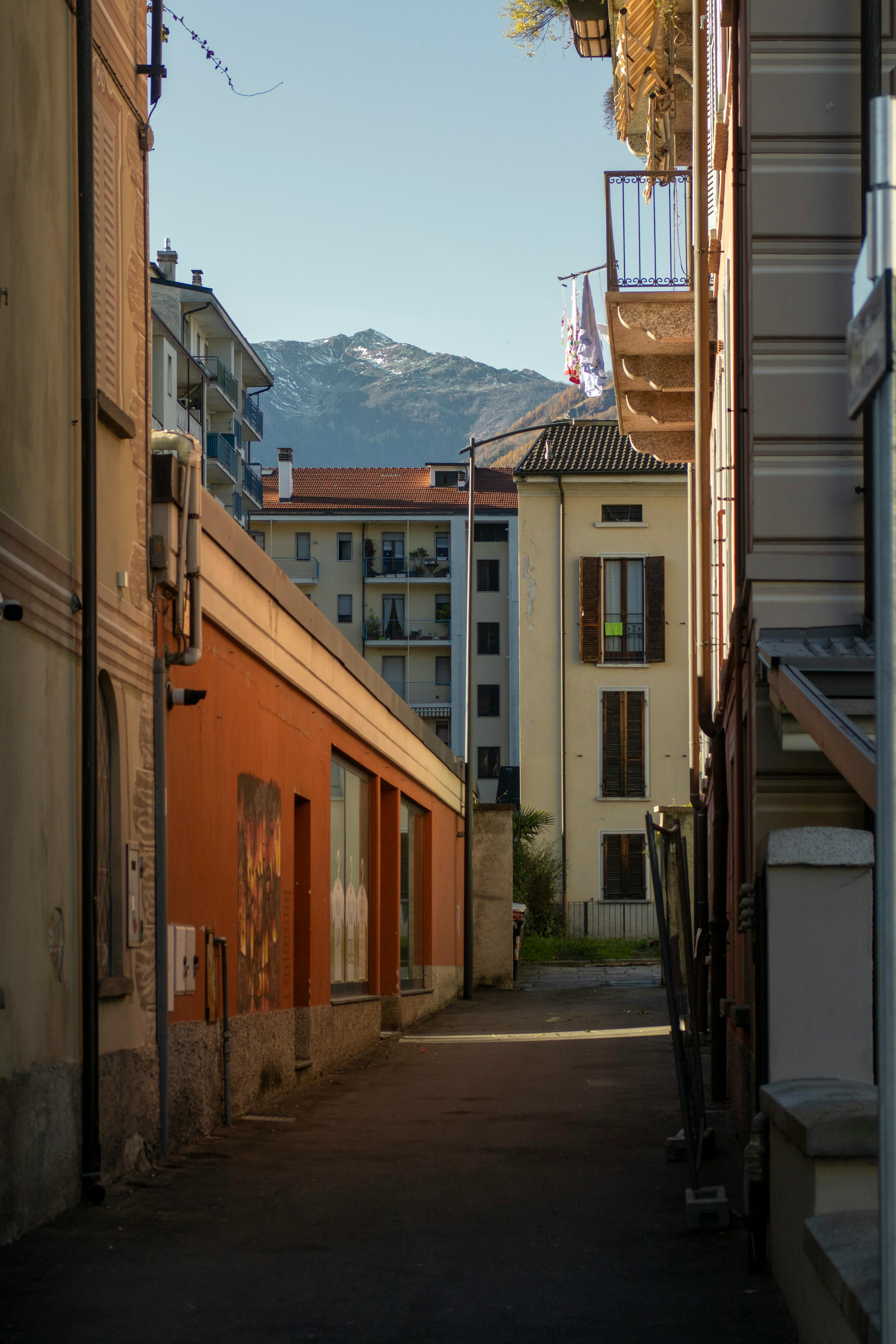 Alley with Residential Buildings in City · Free Stock Photo