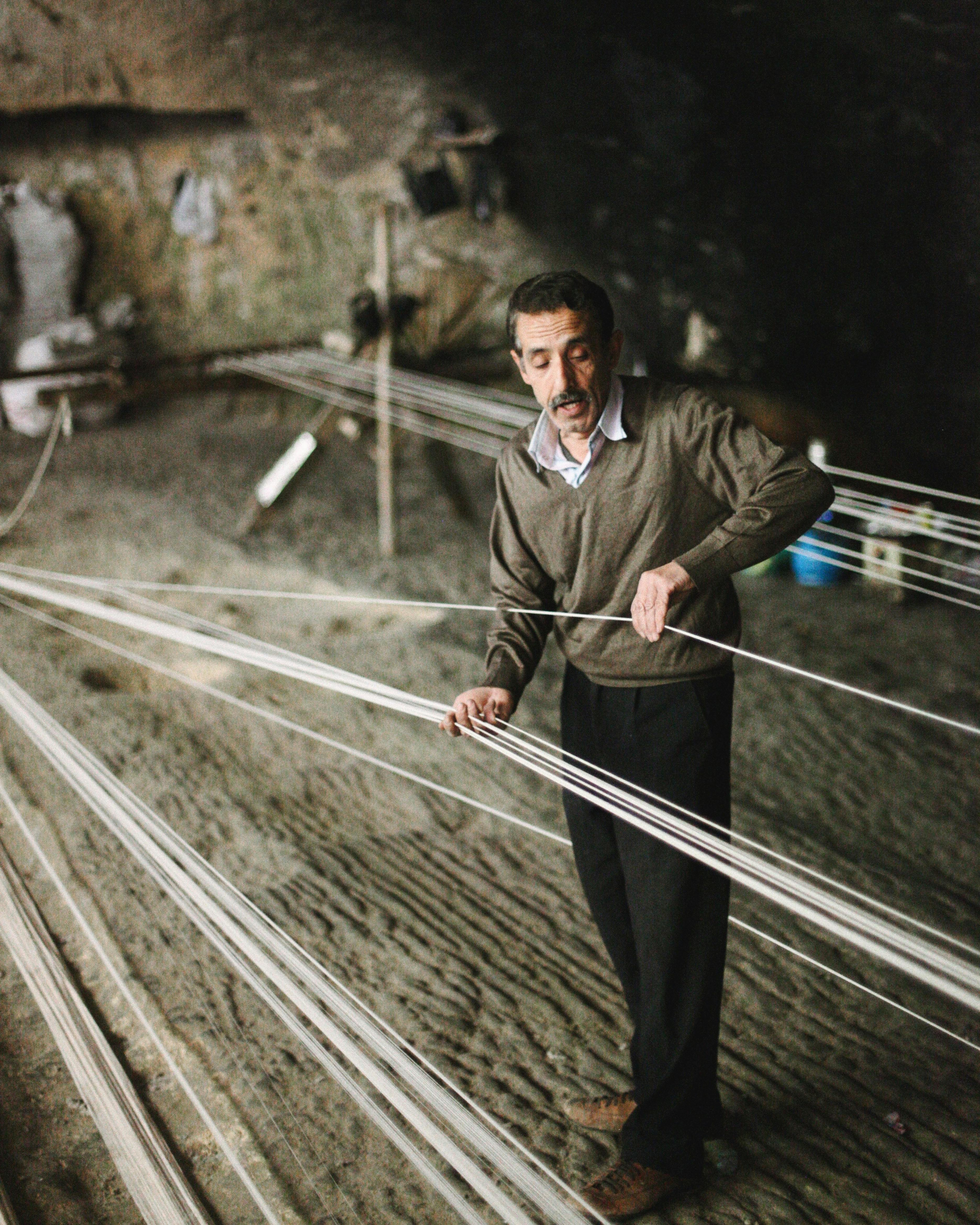 Elderly Man Holding Strings · Free Stock Photo