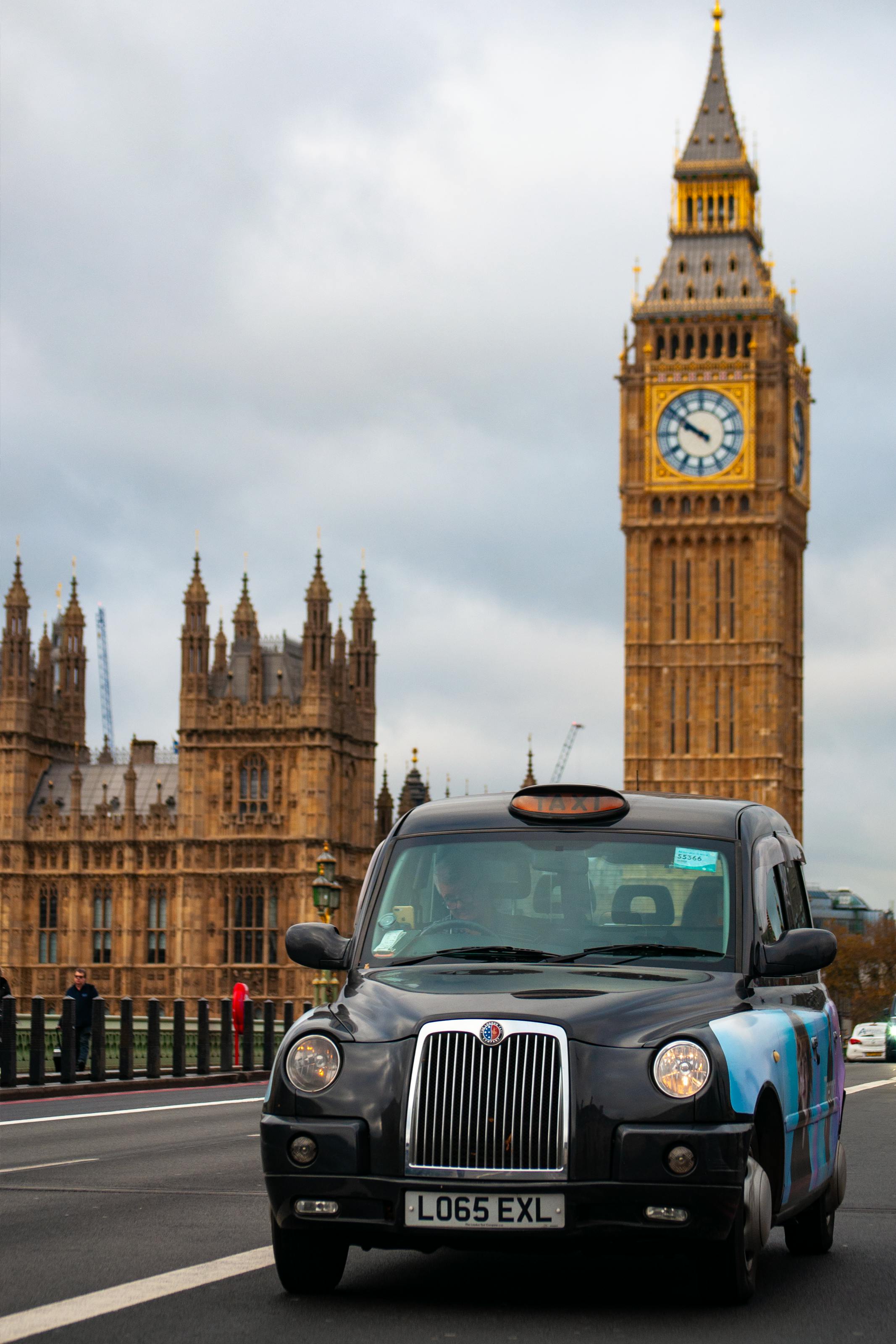 Black Taxi in London with Big Ben behind · Free Stock Photo