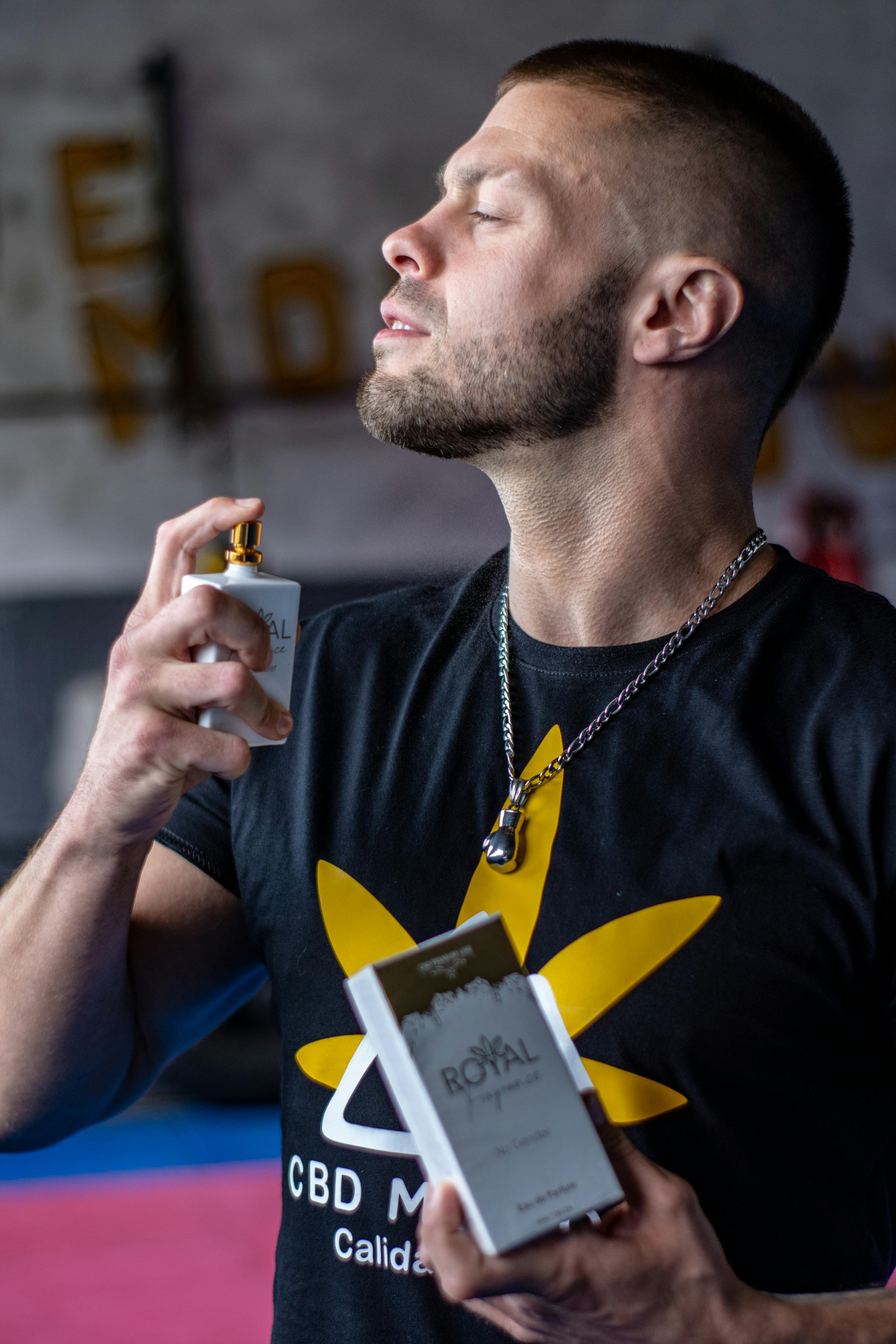 Man Prancing Around with Perfume · Free Stock Photo